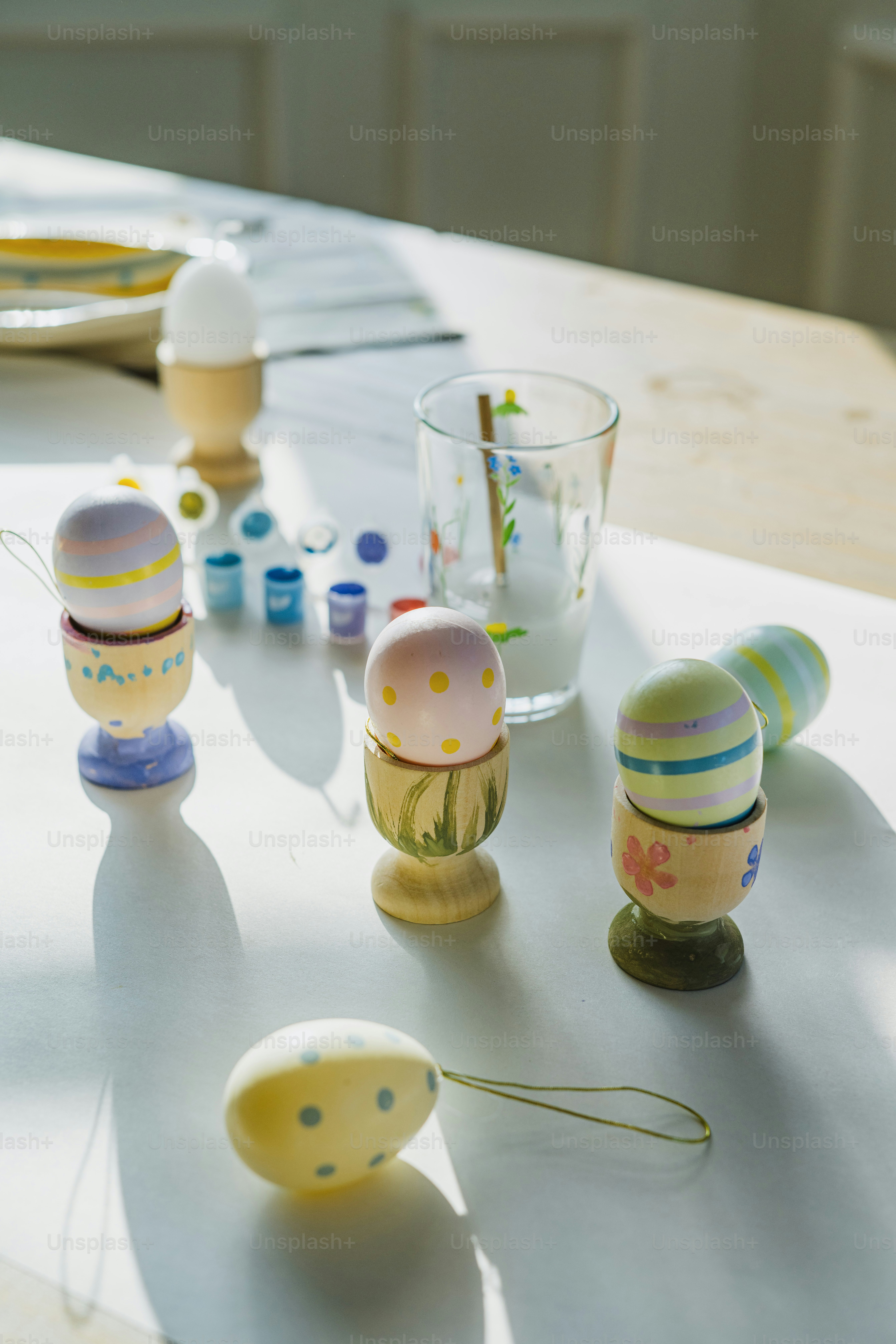 A table topped with lots of different colored eggs photo – Eggs Image ...