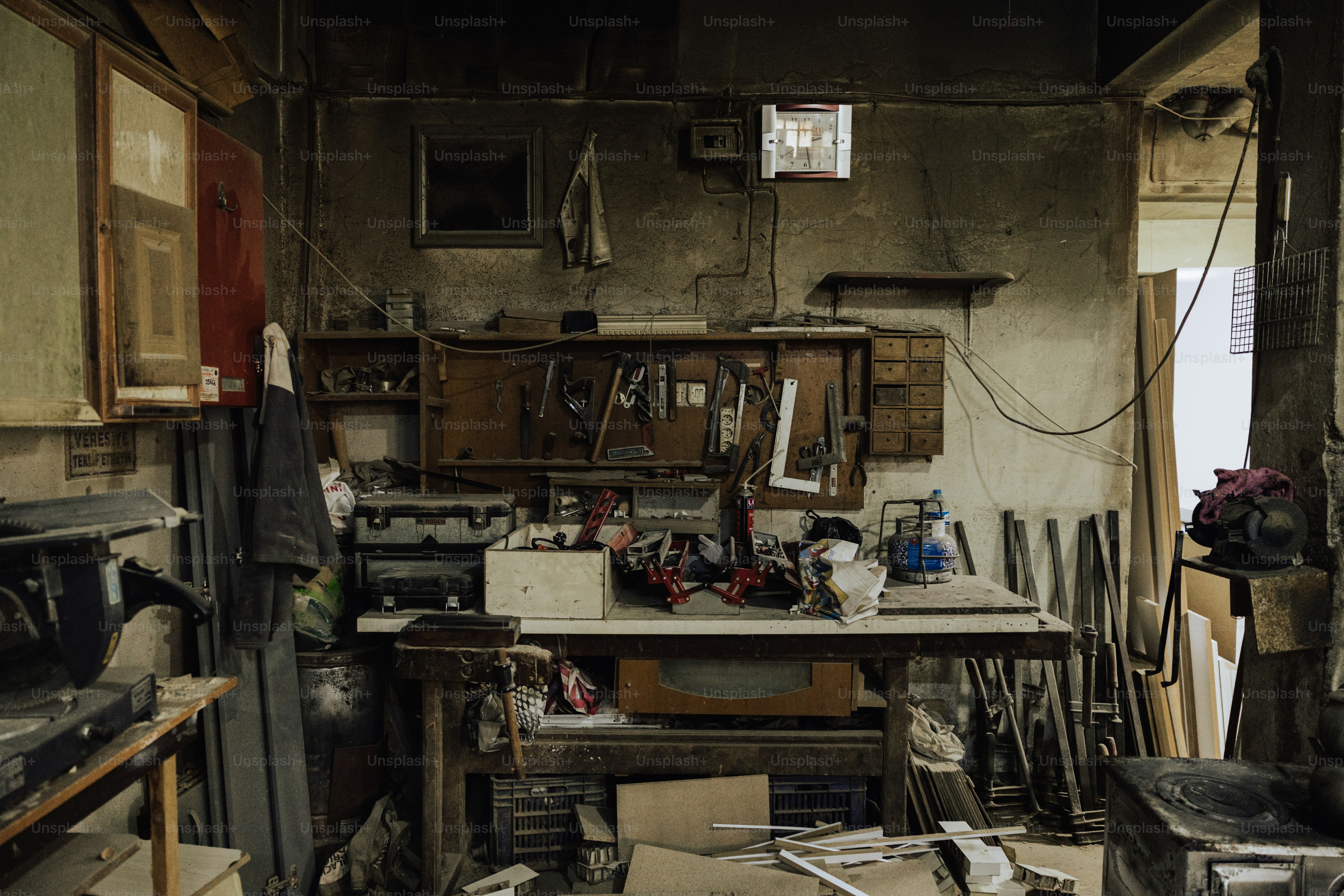 A room filled with lots of clutter and tools photo – Professional Image ...