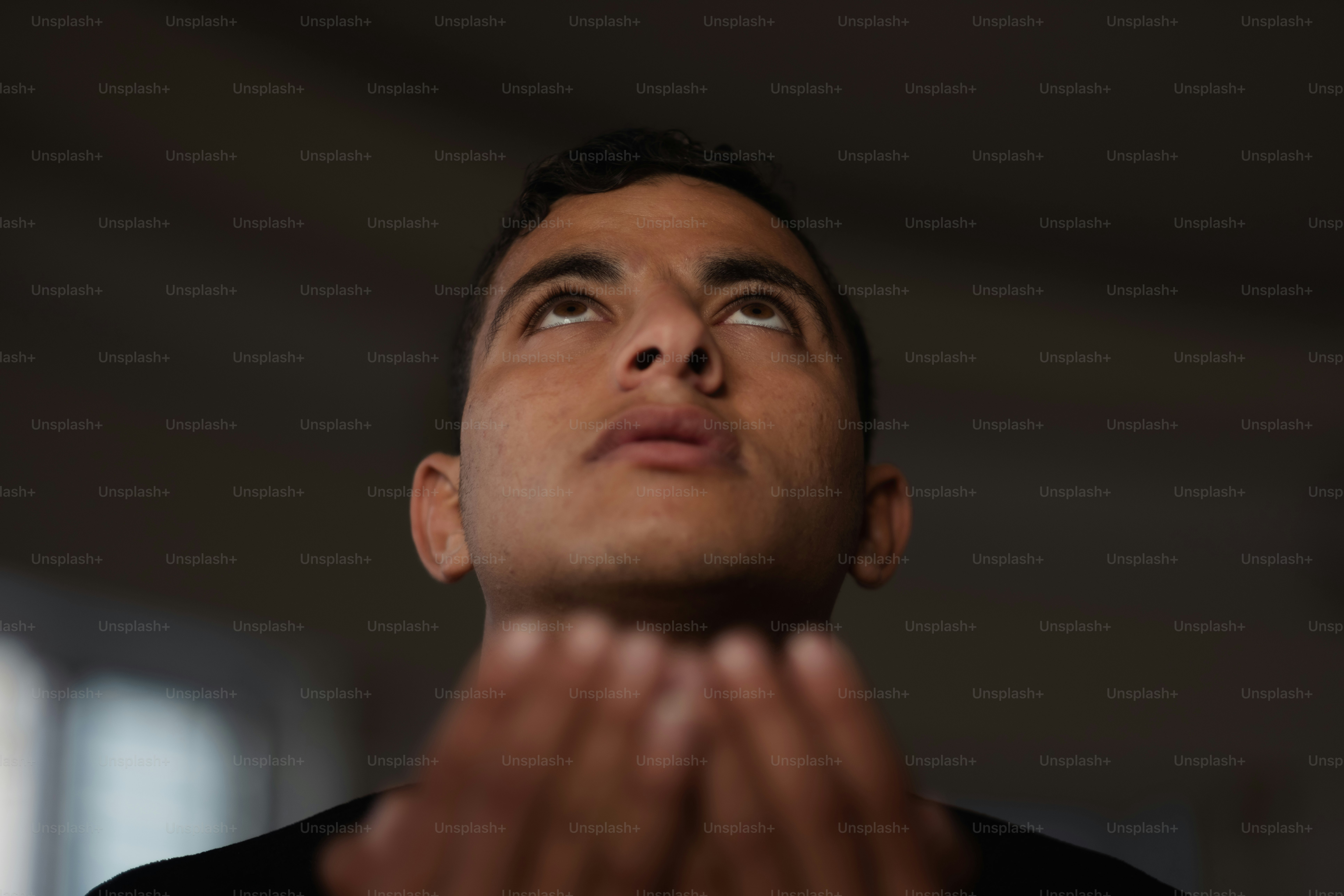 A man is praying with his hands together photo – Muslim praying Image ...