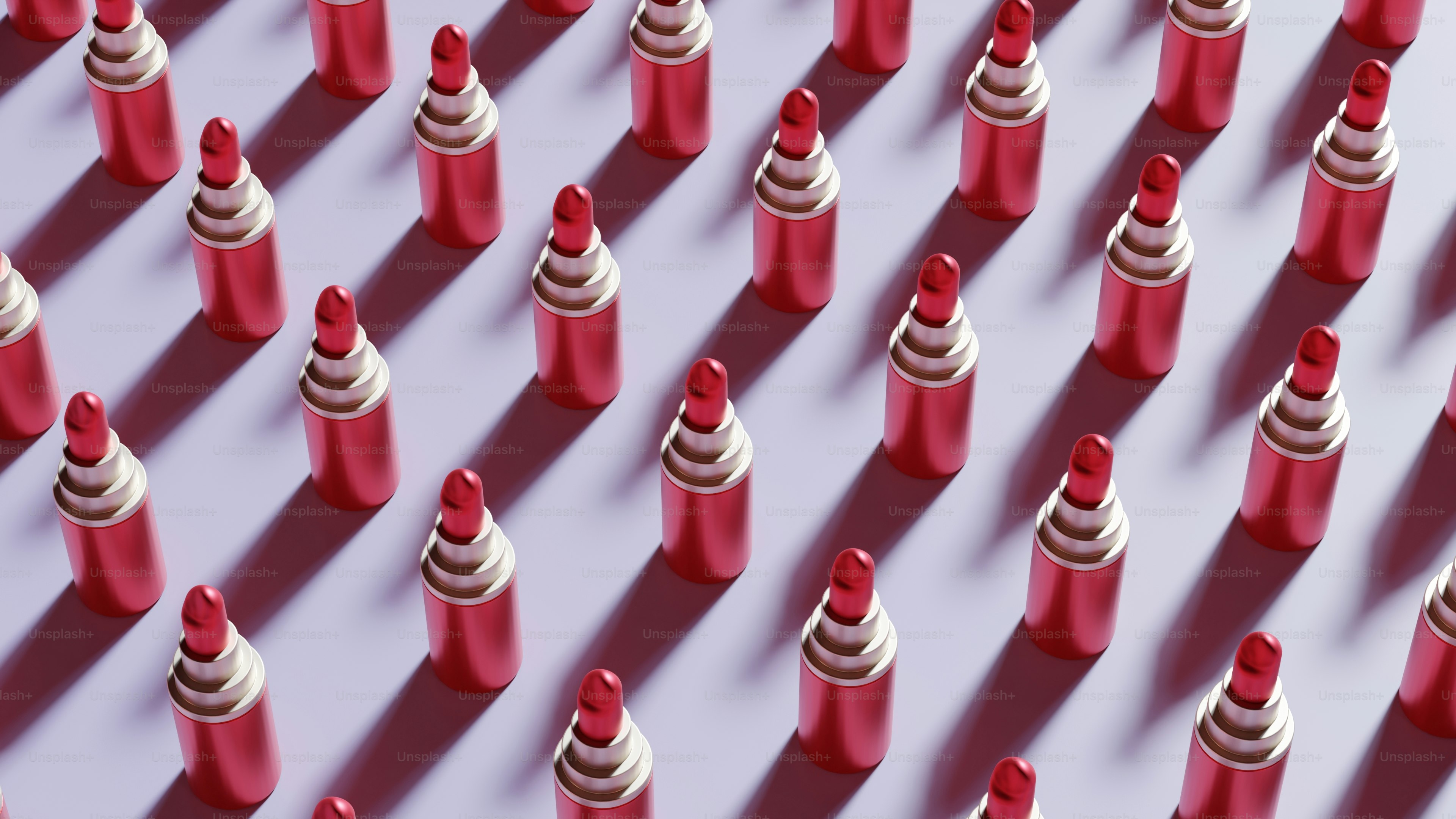 A group of red and white lipsticks on a purple surface photo – Lipstick ...