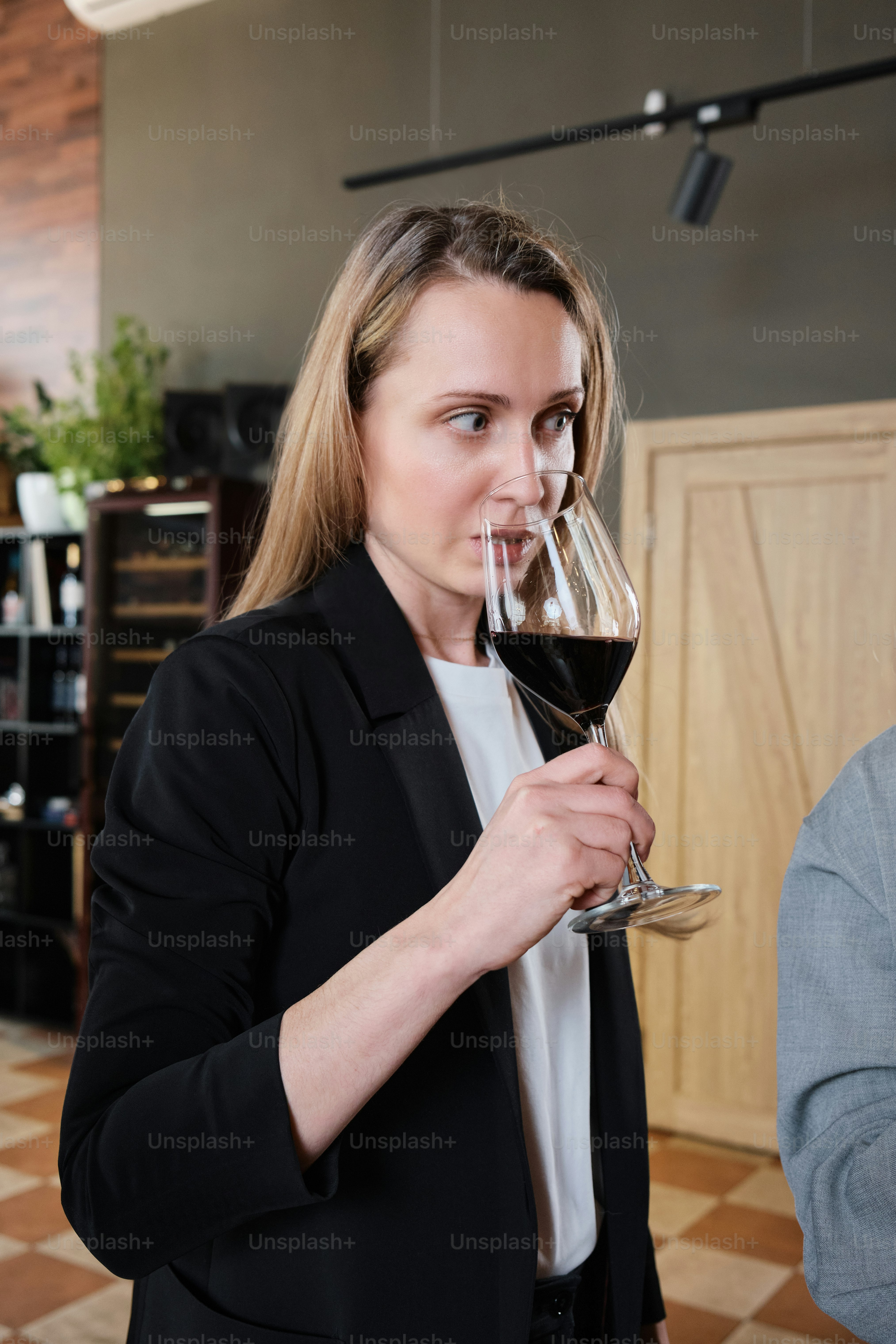 A person pouring a glass of wine into a wine glass photo – Wine Image ...