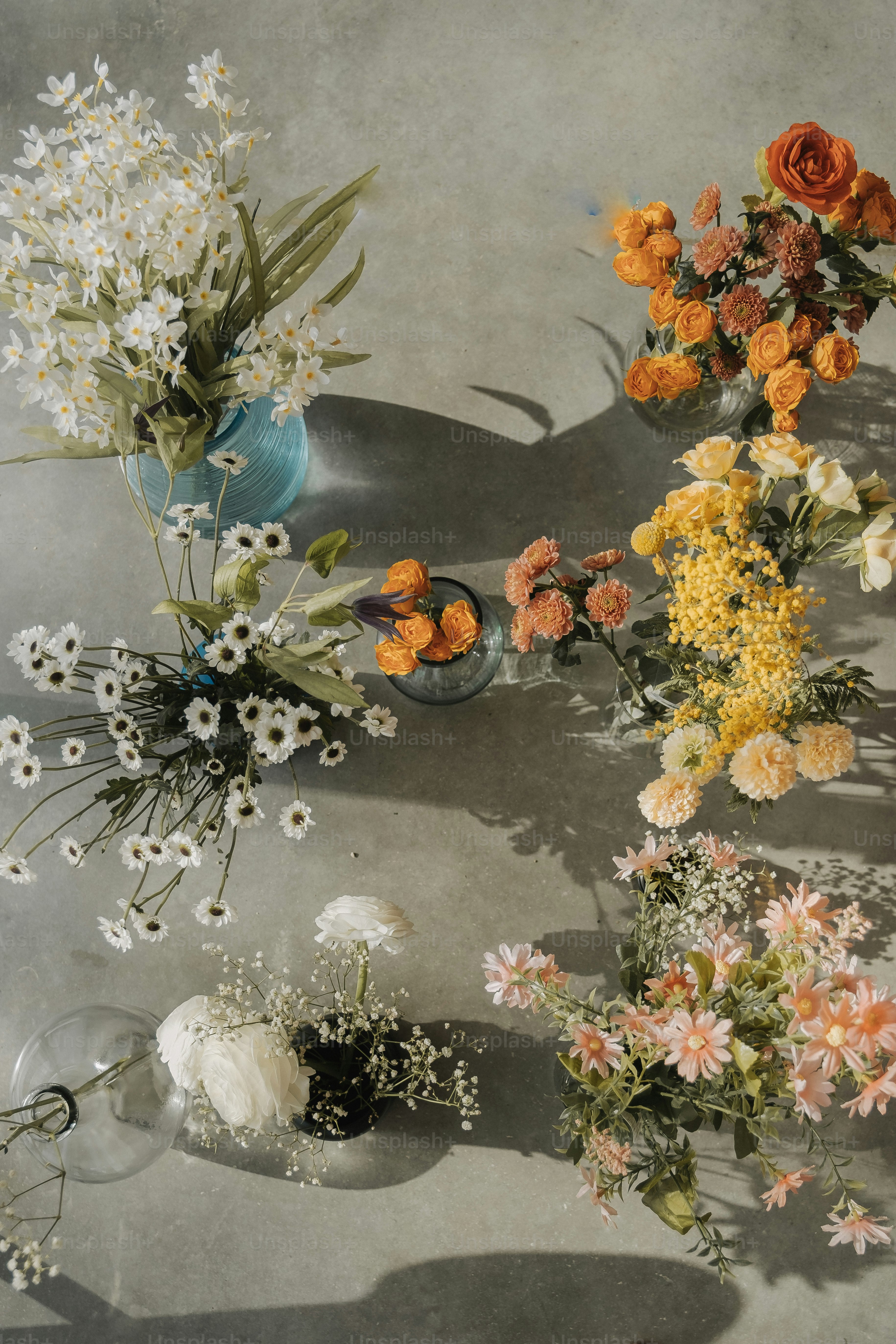 A group of flowers sitting on top of a table photo – Flora Image on ...