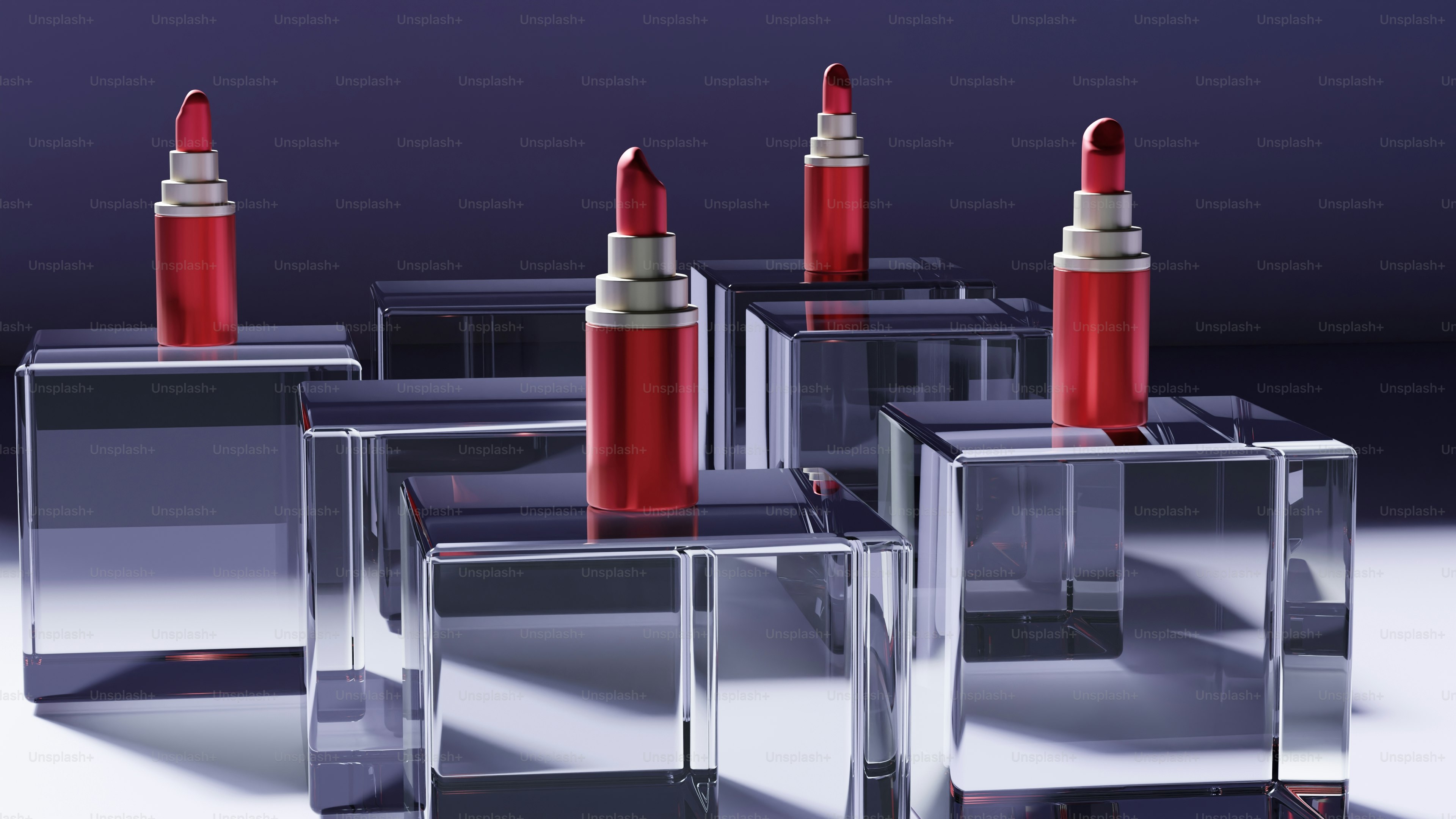 A group of four red lipsticks sitting on top of each other photo ...
