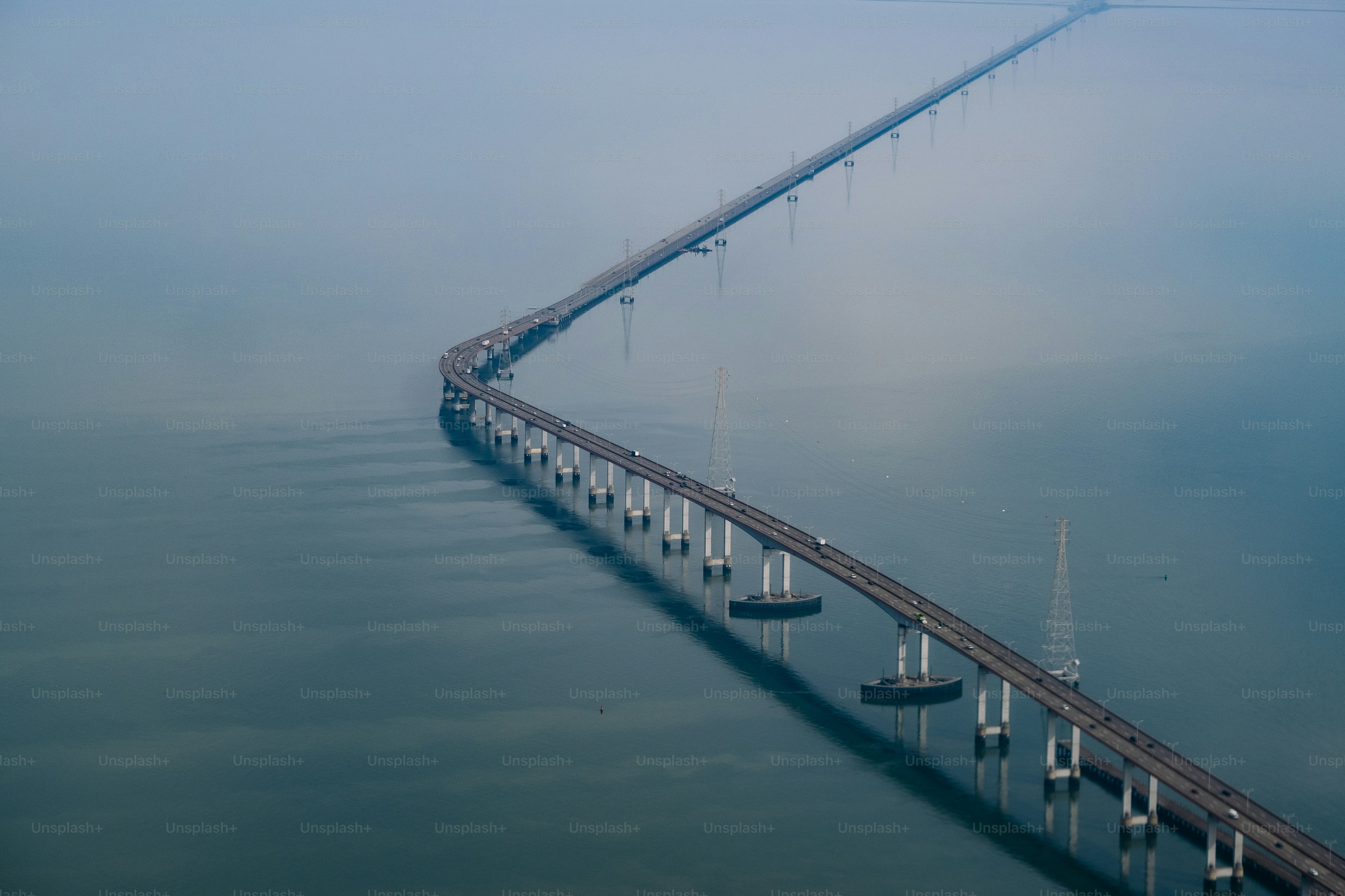 A large bridge spanning over a large body of water photo – Bridge Image ...