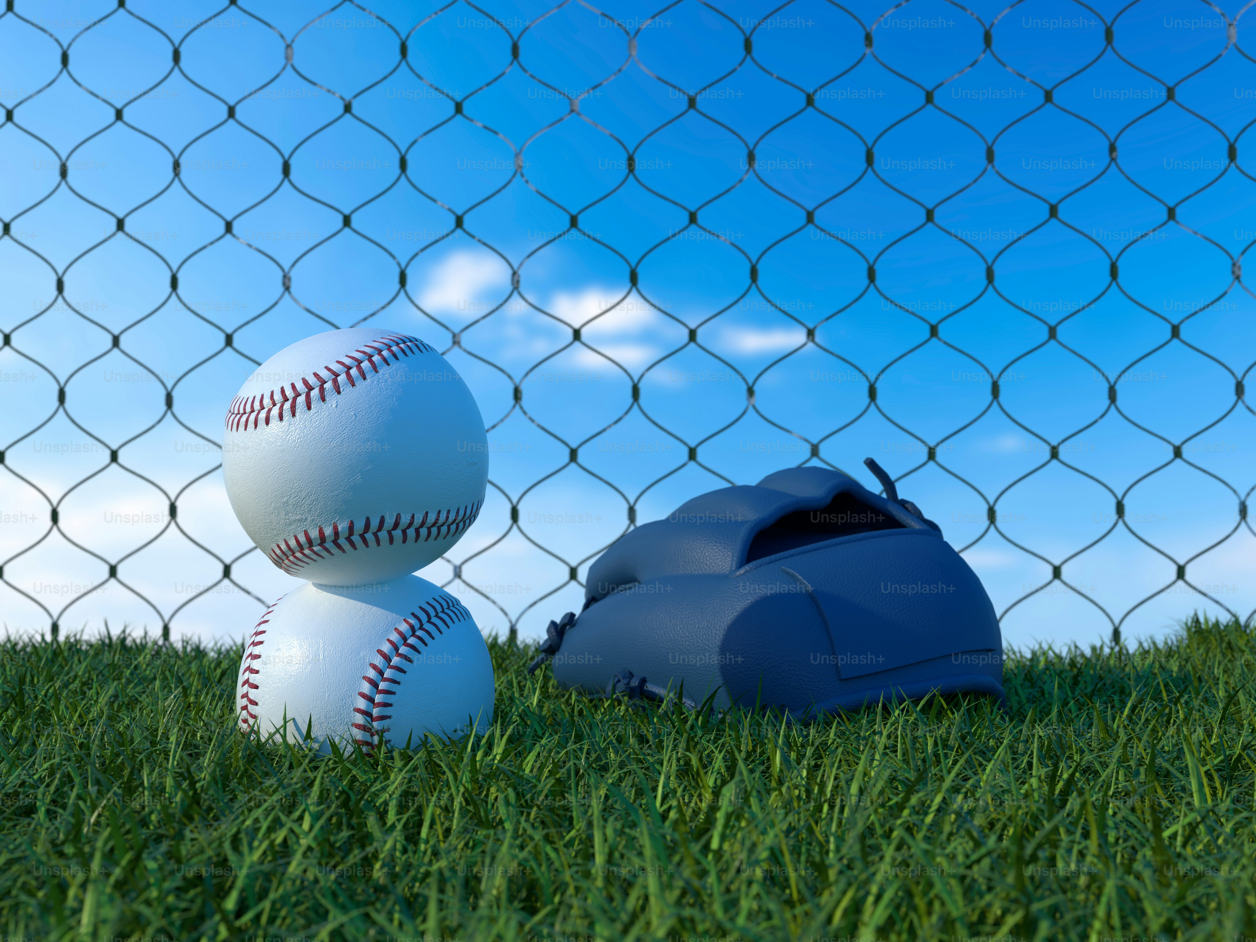 A baseball and a catchers mitt sitting in the grass photo – Background ...