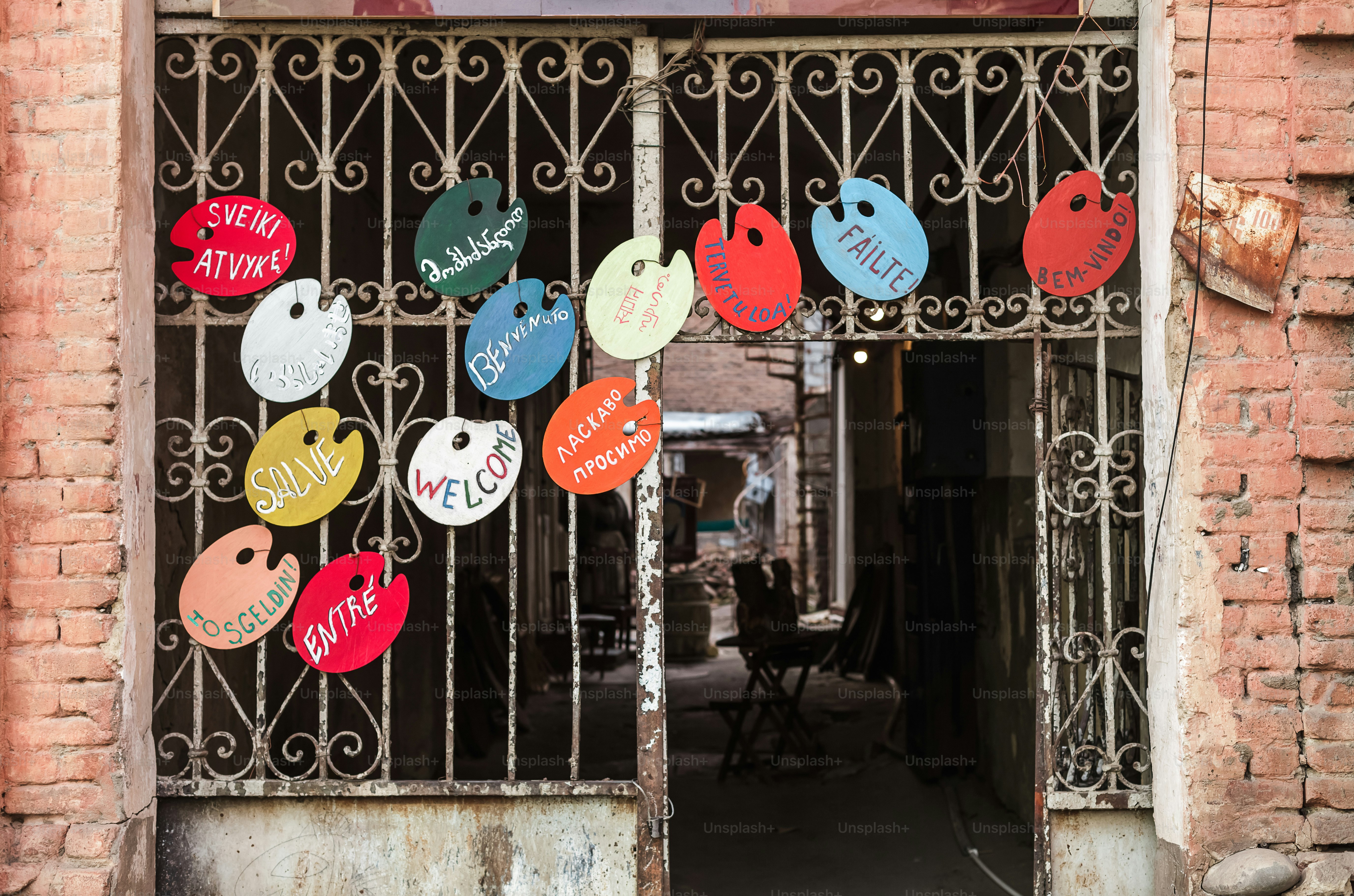 A gate with a bunch of colorful signs on it photo – Multiple choice ...