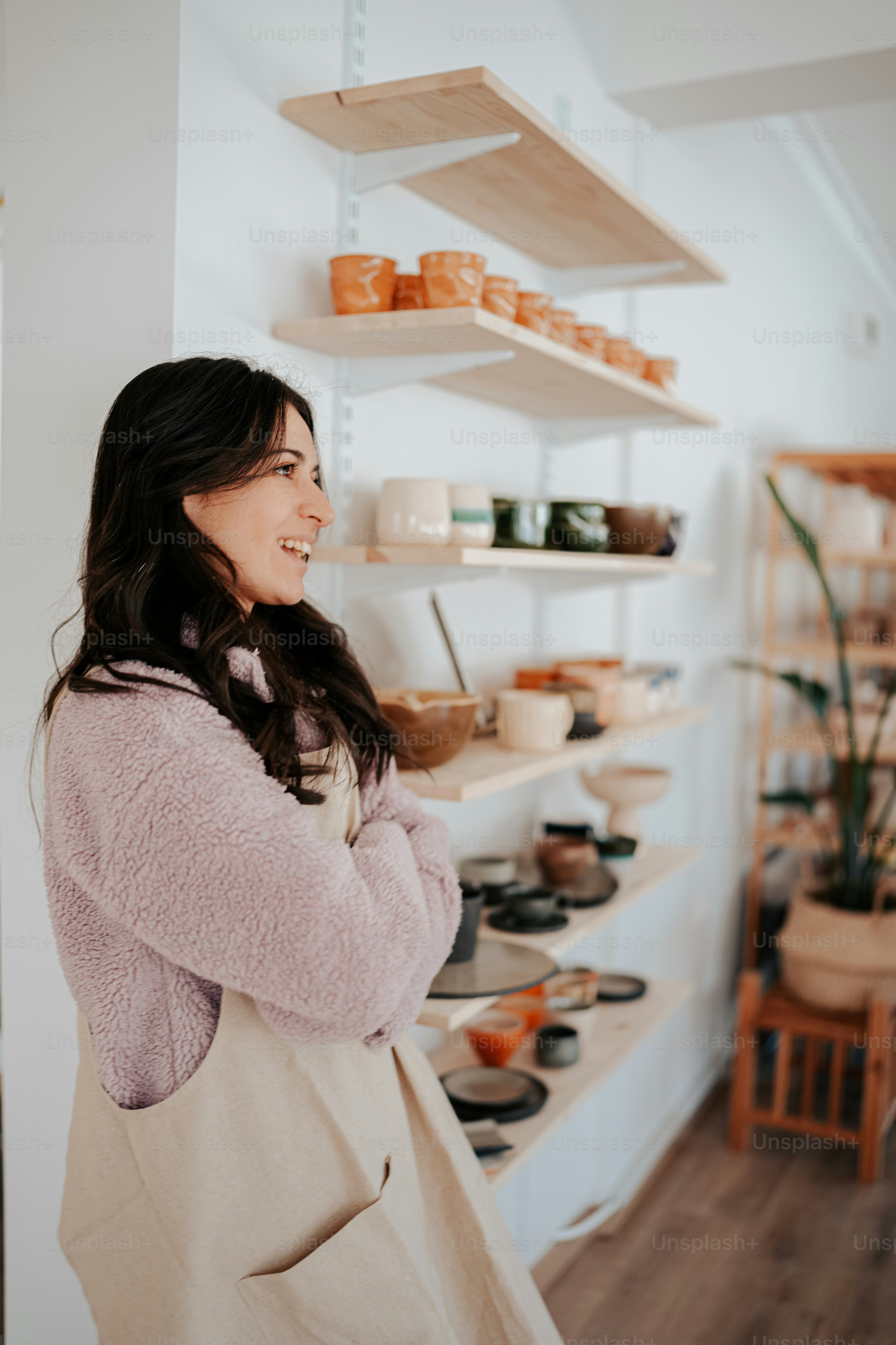 A woman standing in front of a shelf of food photo – Soapstone Image on ...