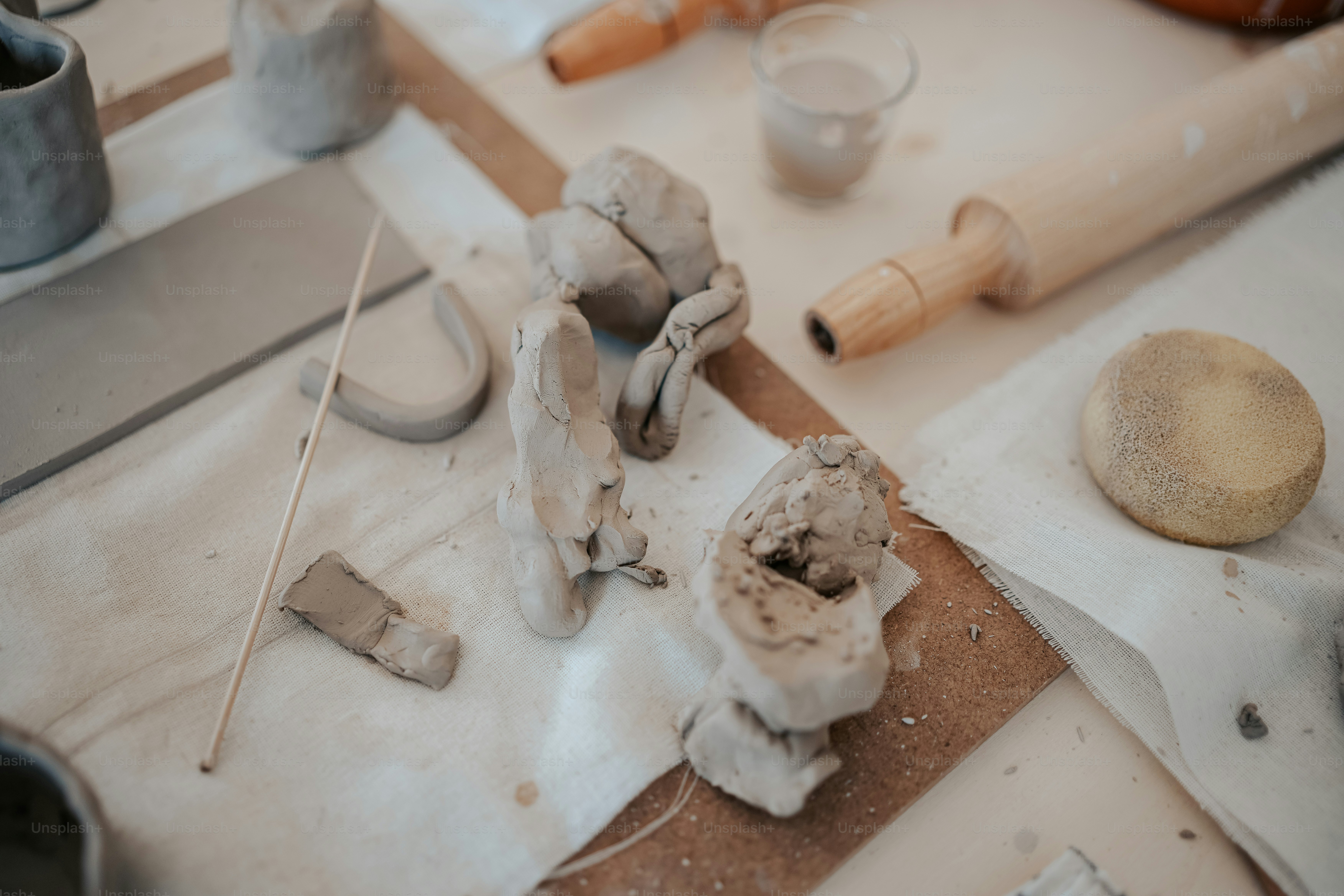 A table topped with lots of different types of pottery photo ...