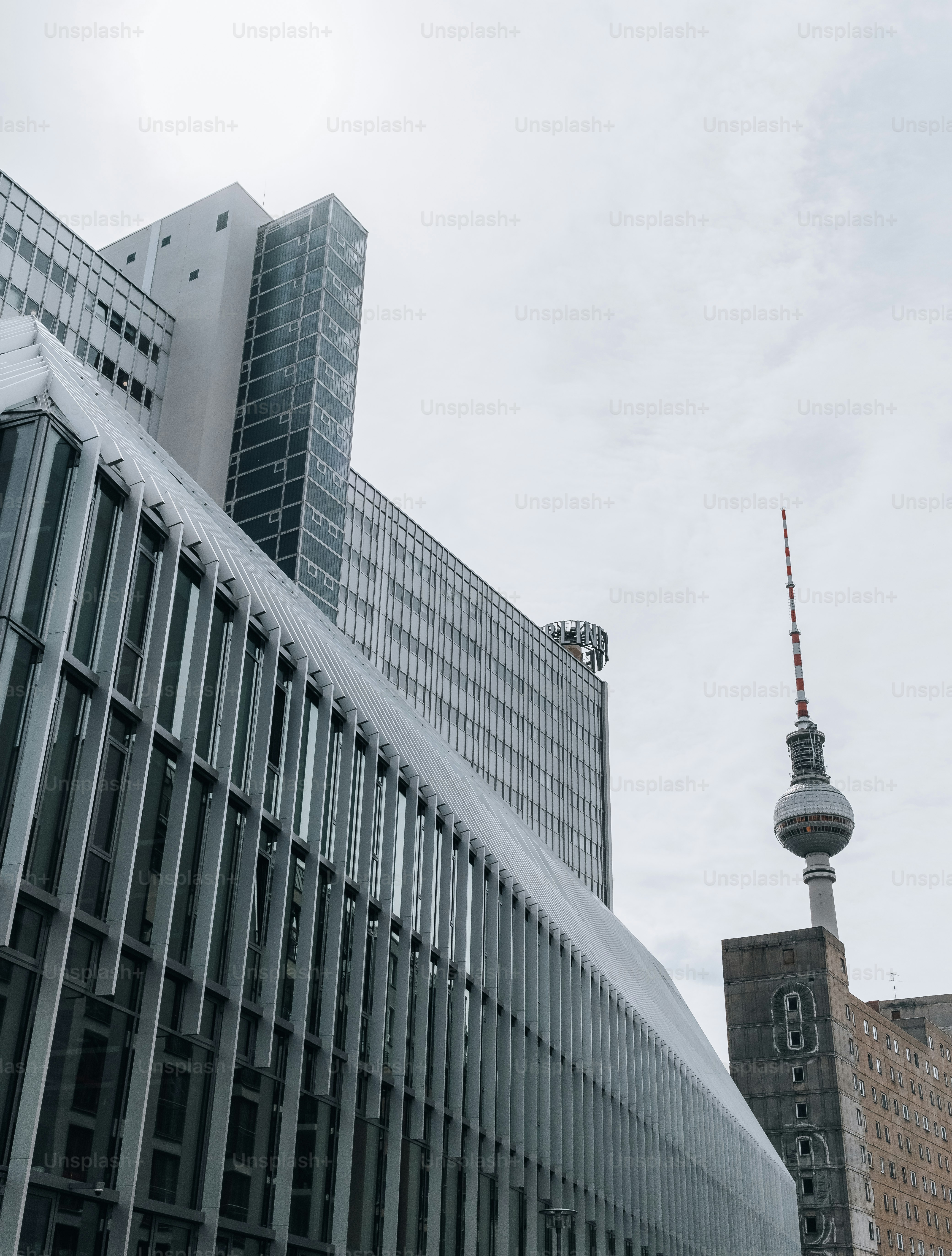 A very tall building with a very tall tower in the background photo ...