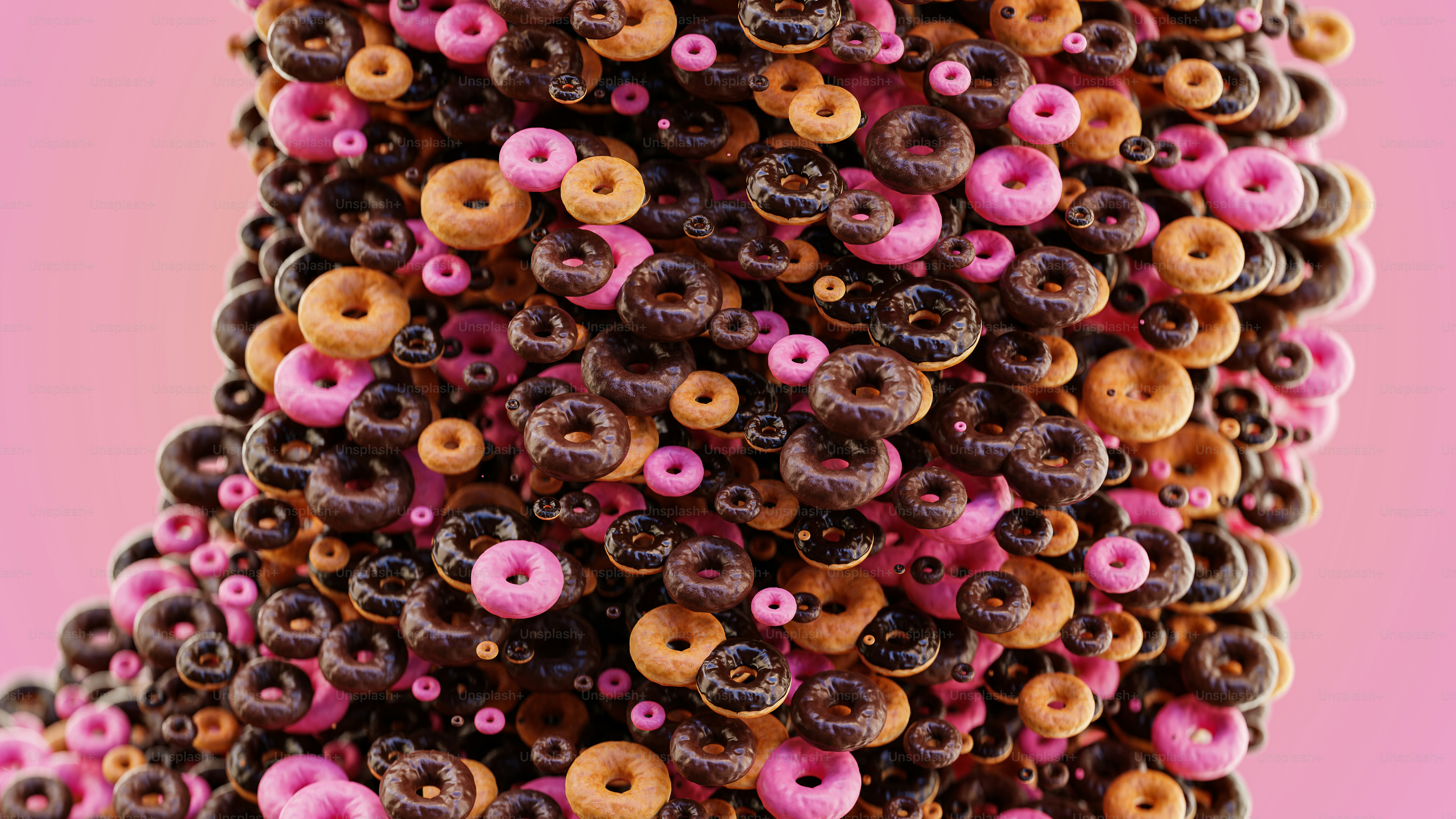 A bunch of donuts that are stacked on top of each other photo ...