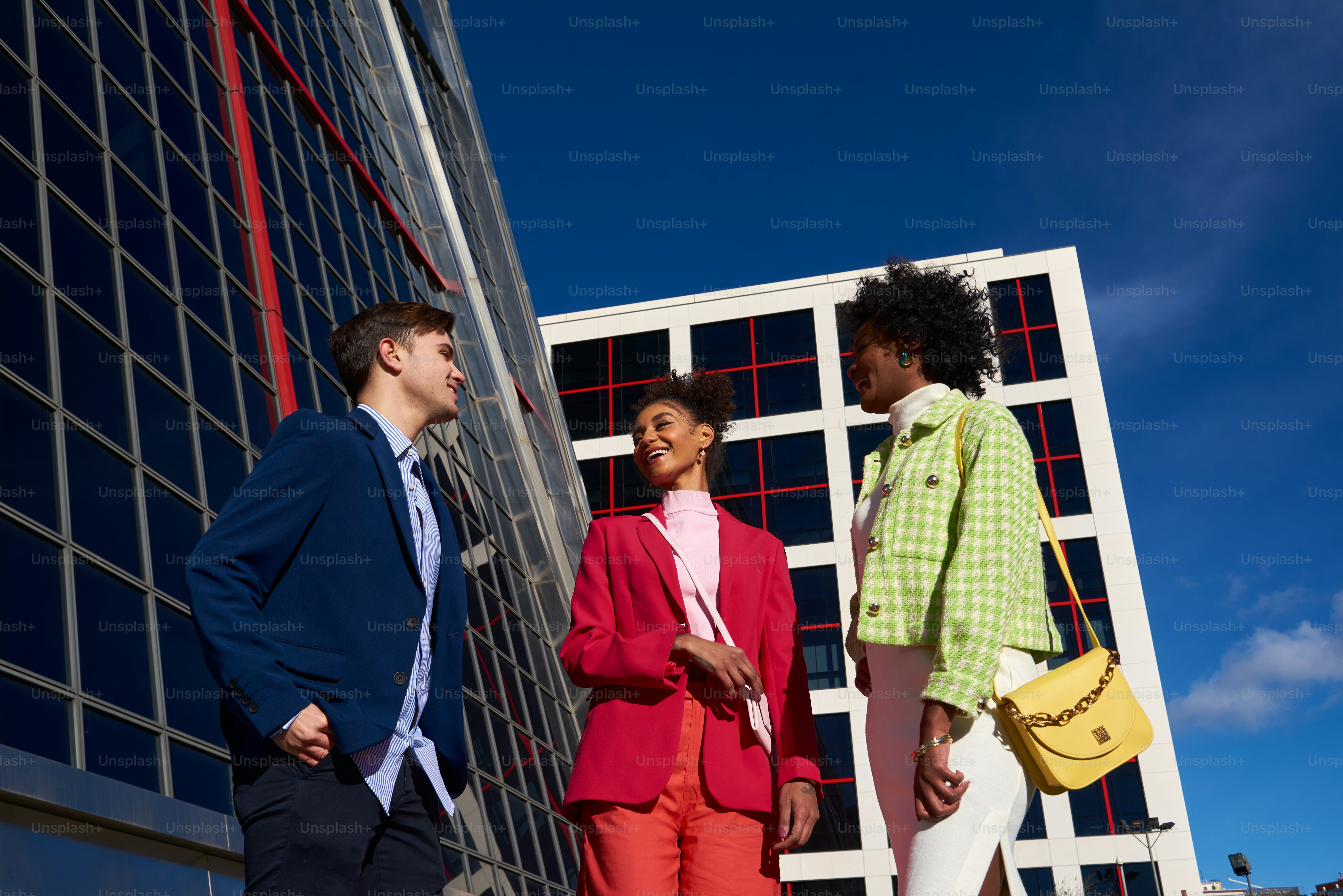 A group of three people standing next to each other photo – People ...