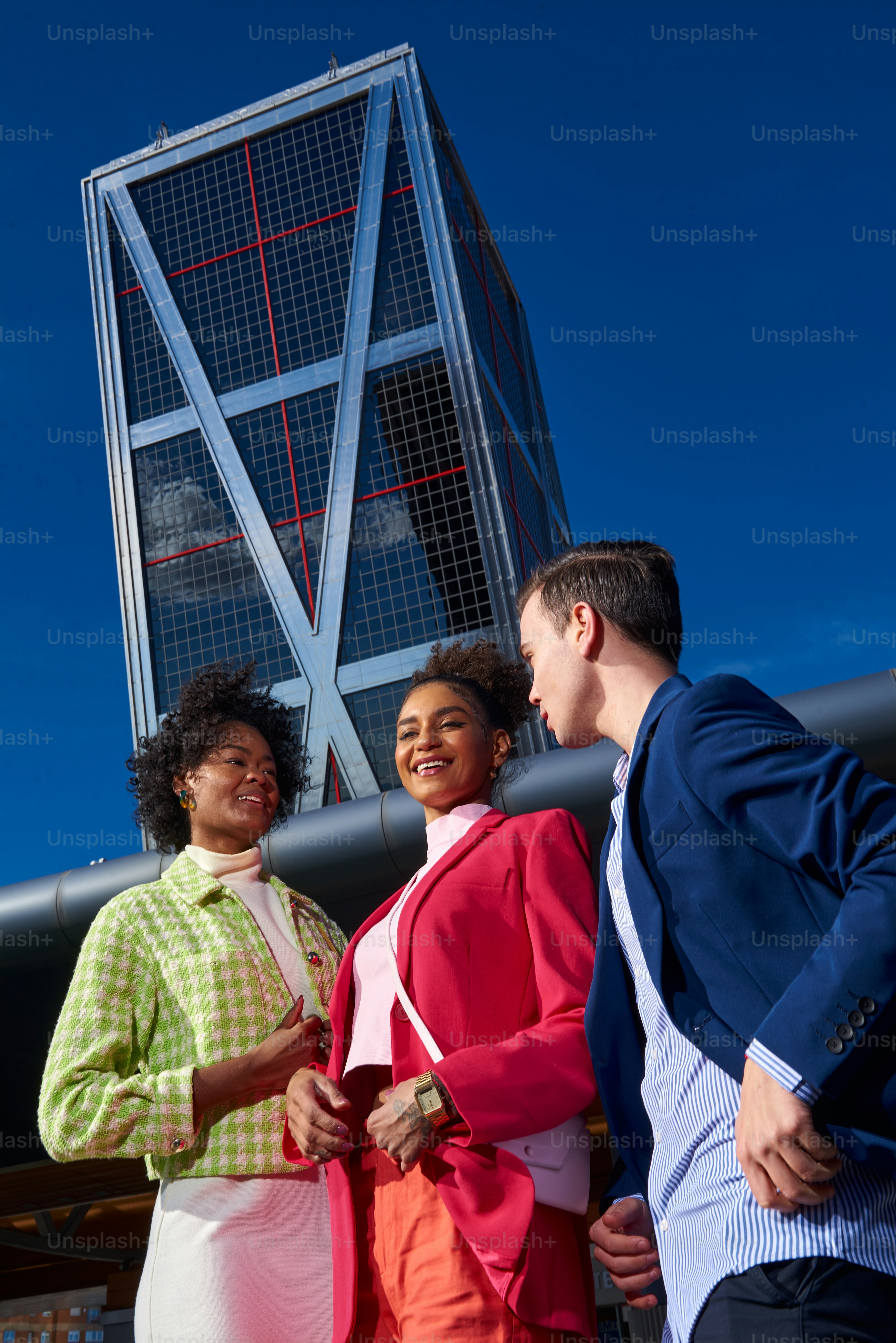 A group of three people standing next to each other photo – People ...