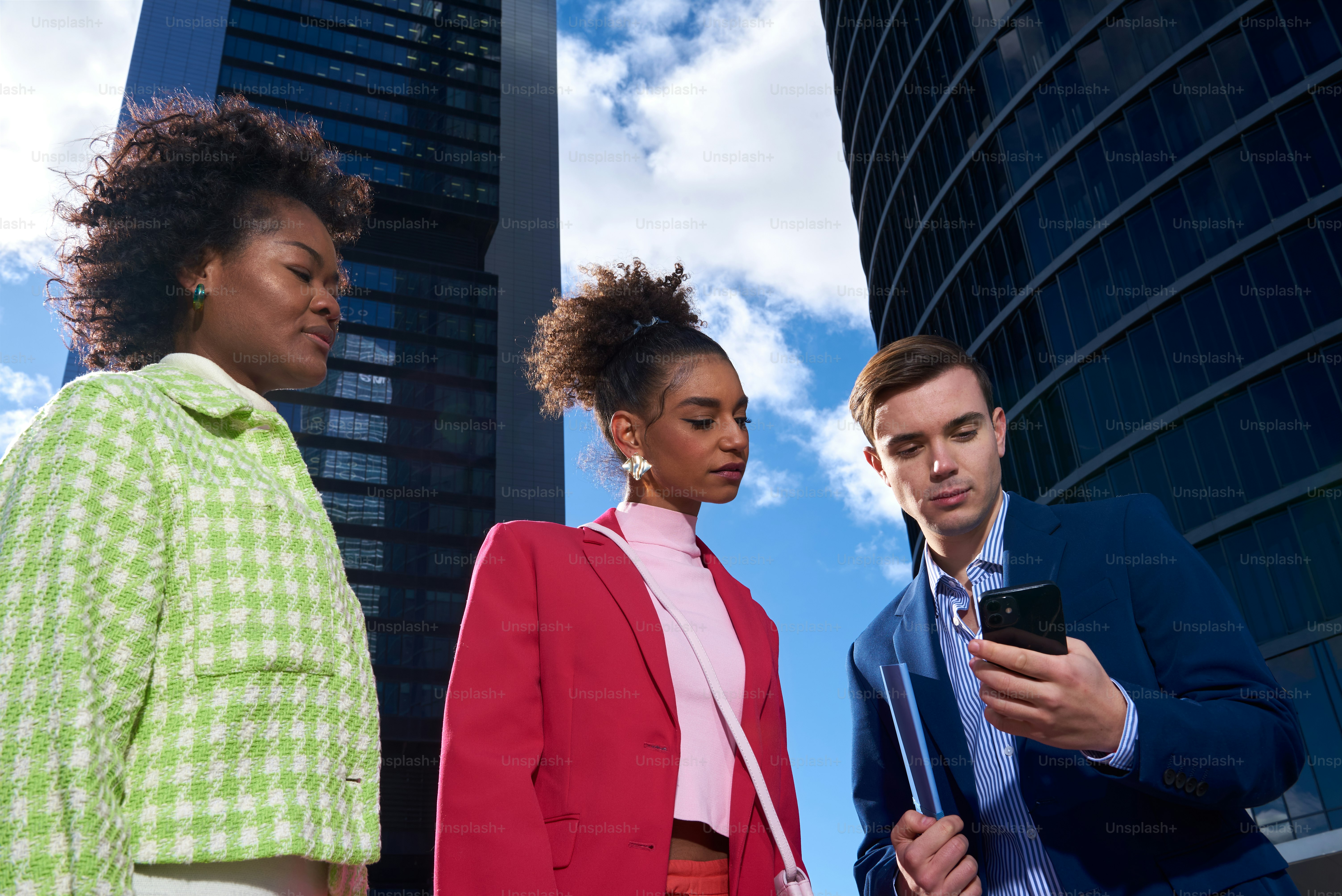 A group of three people standing next to each other photo – Mobile ...
