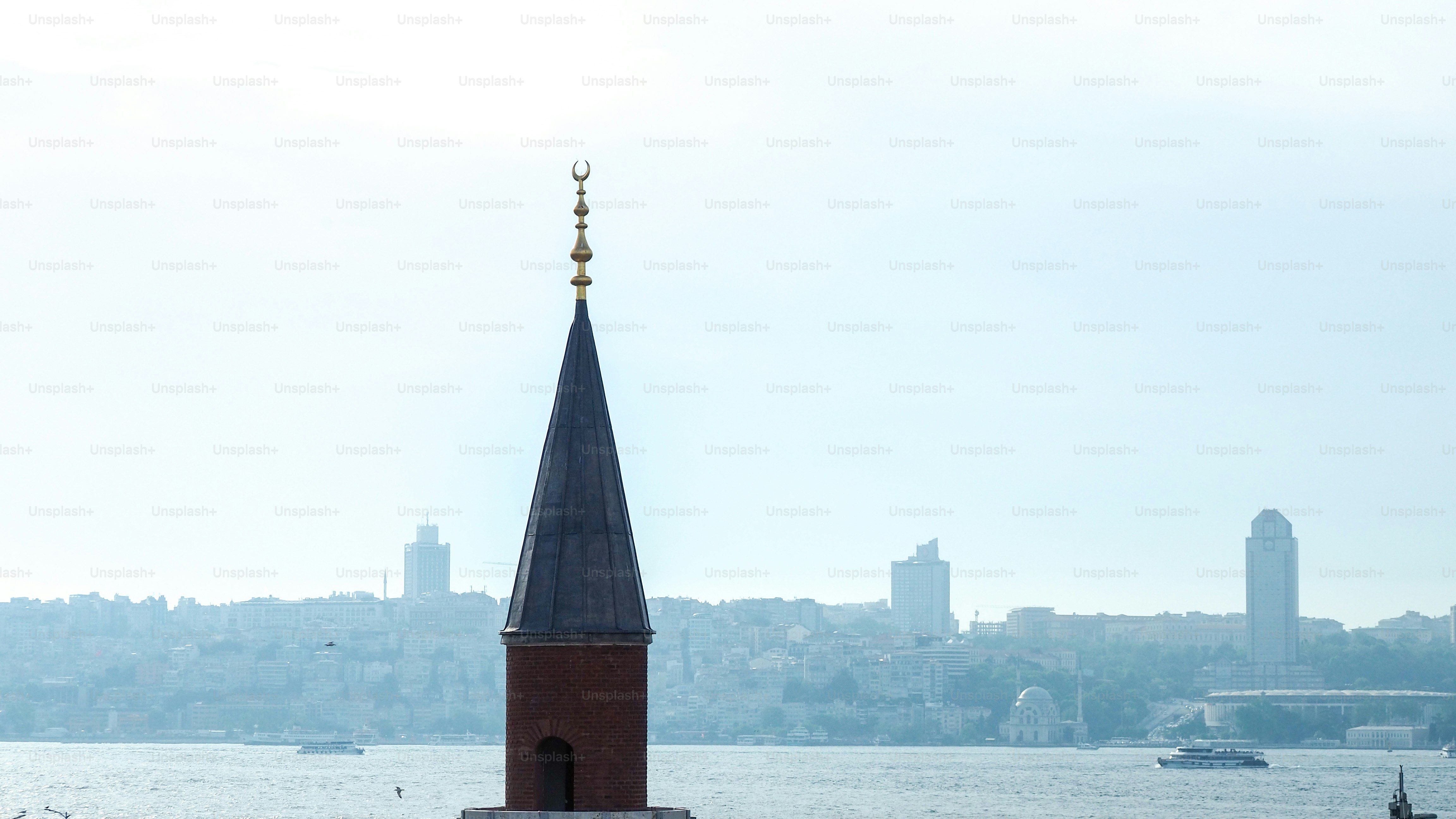 A church steeple with a view of a city in the background photo ...