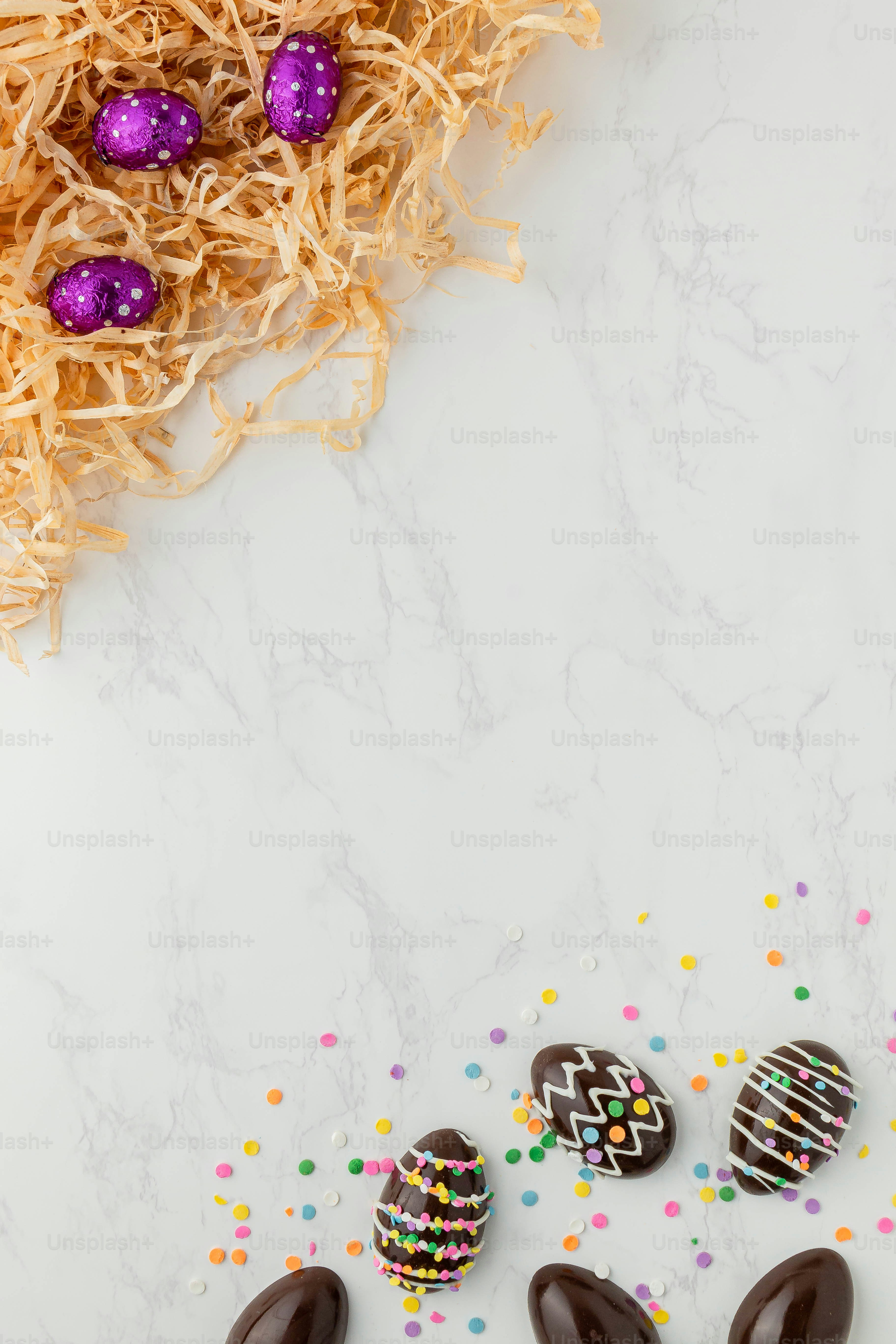 A table topped with chocolate eggs and sprinkles photo – Easter egg ...