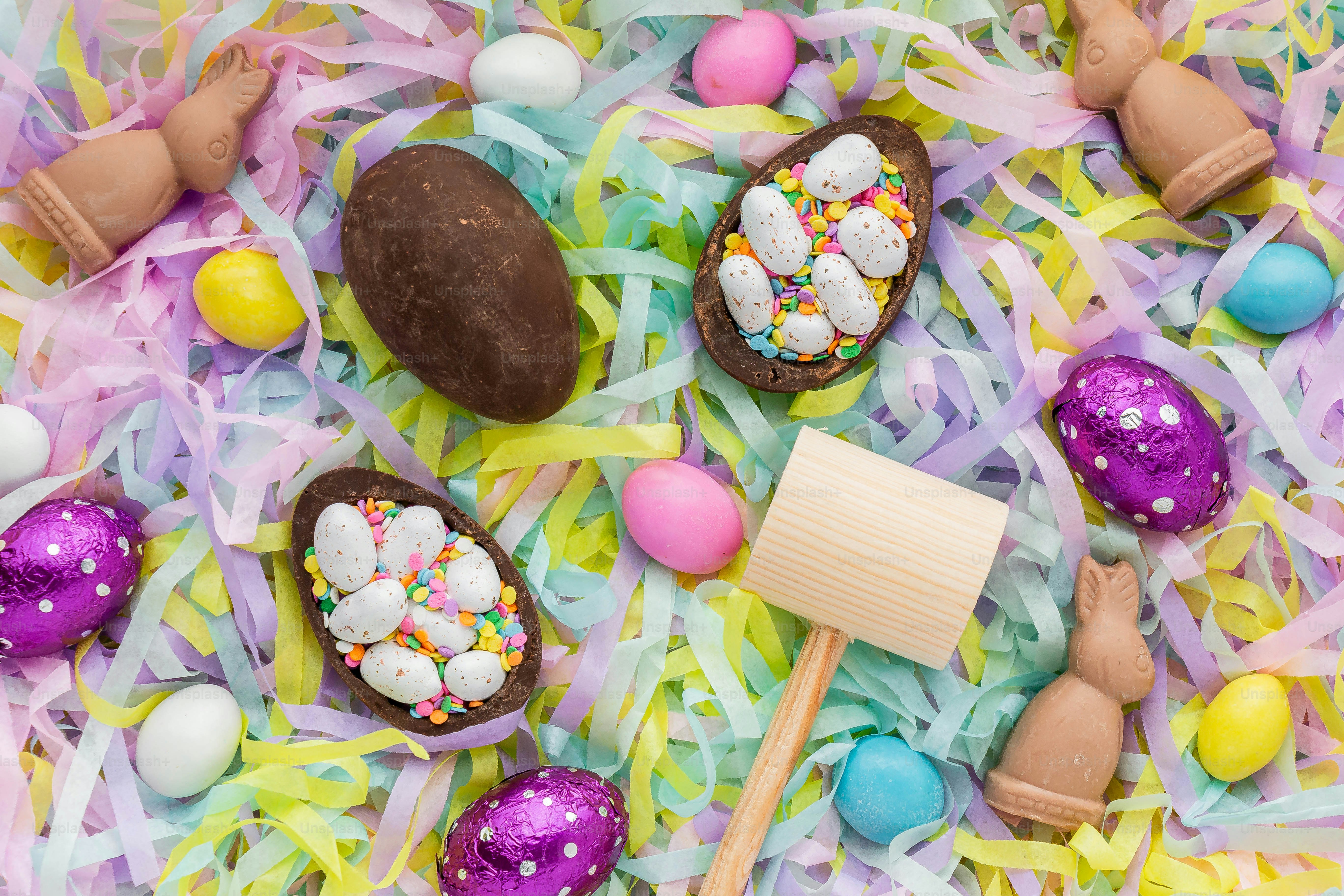 A table topped with chocolate eggs and sprinkles photo – Easter egg ...