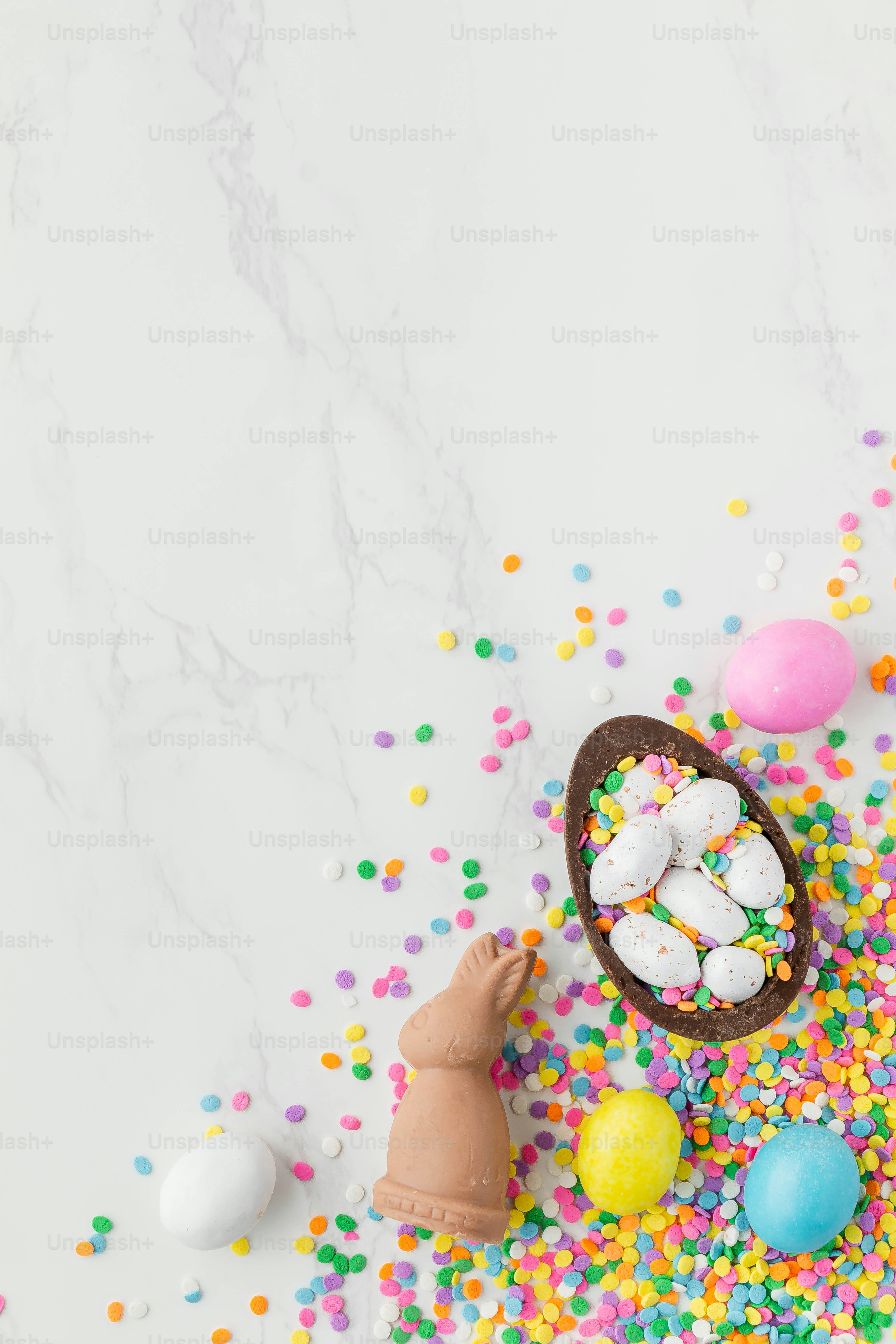 A table topped with lots of colorful sprinkles photo – Easter Image on ...