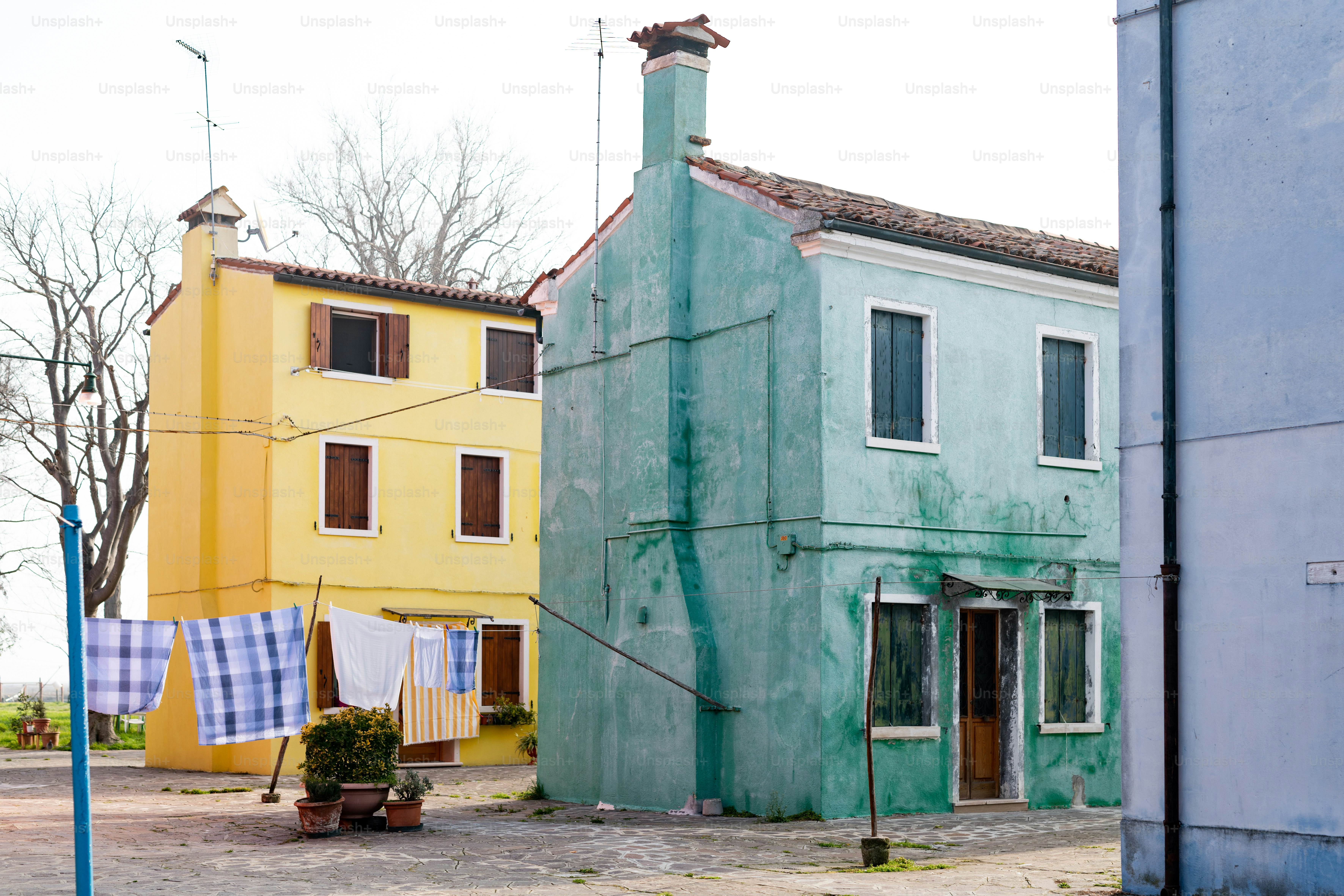 A couple of houses that are next to each other photo – Burano Image on ...