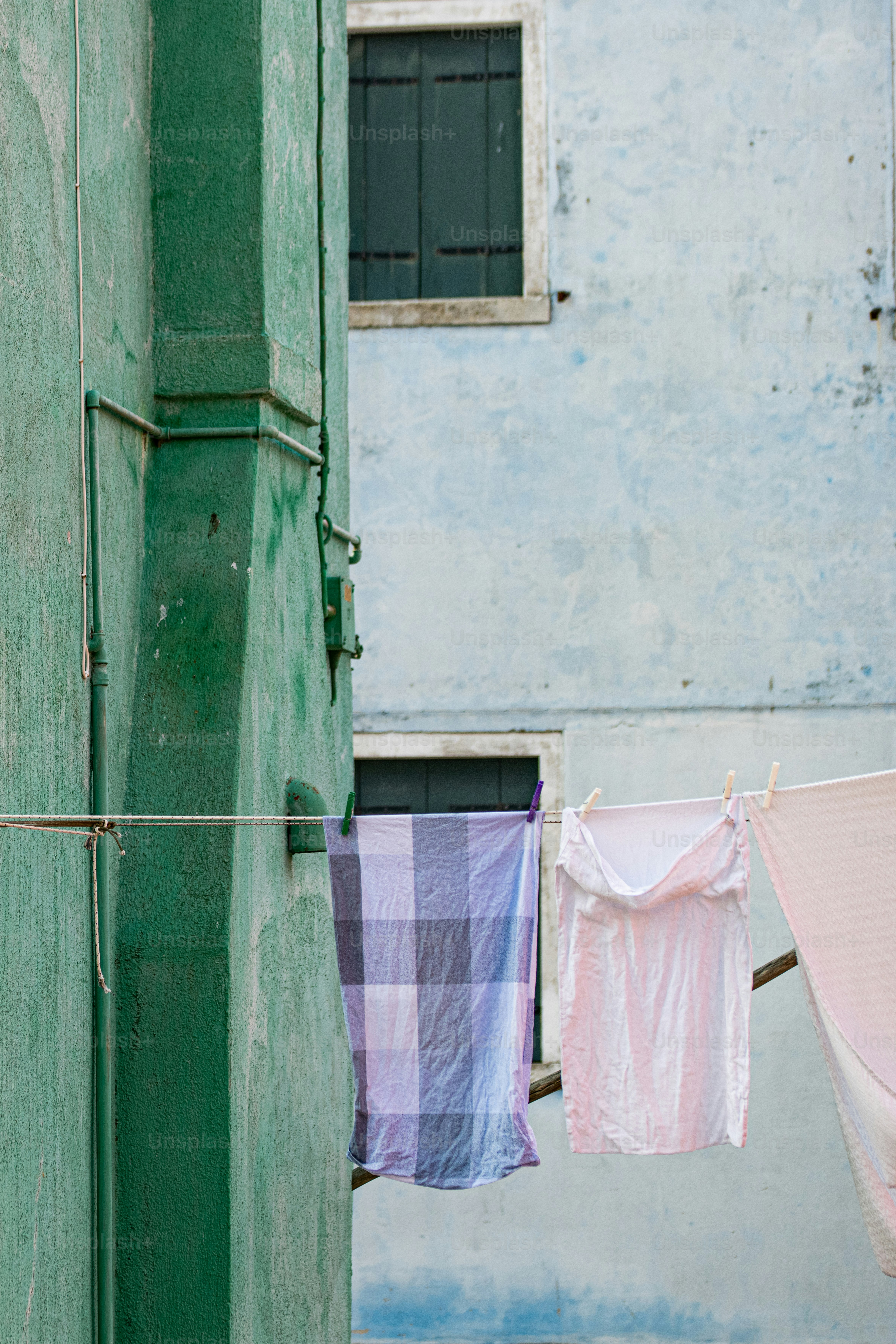 Clothes hanging out to dry on a clothes line photo – Italy Image on ...