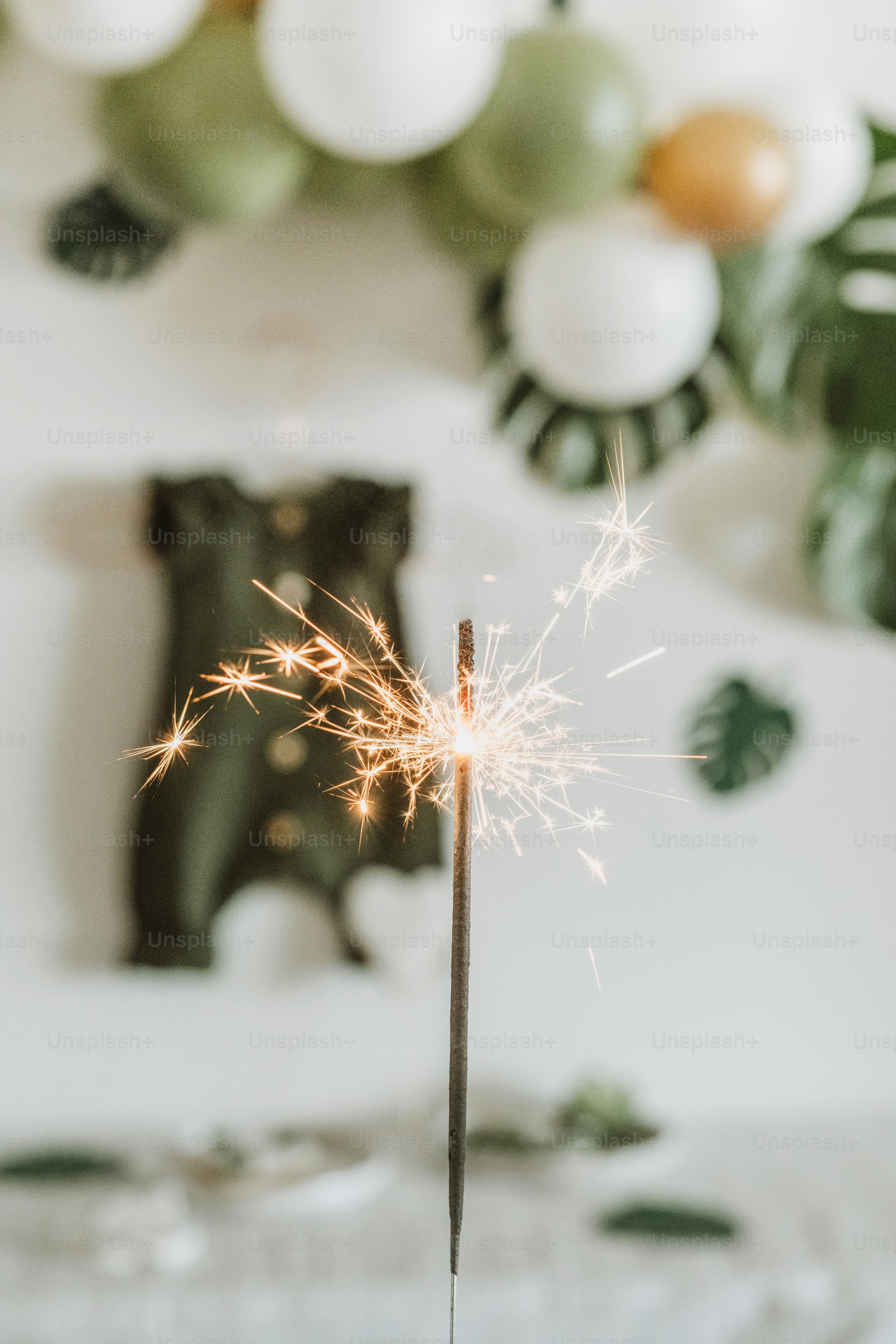 A close up of a sparkler on a table photo – Sparkler Image on Unsplash