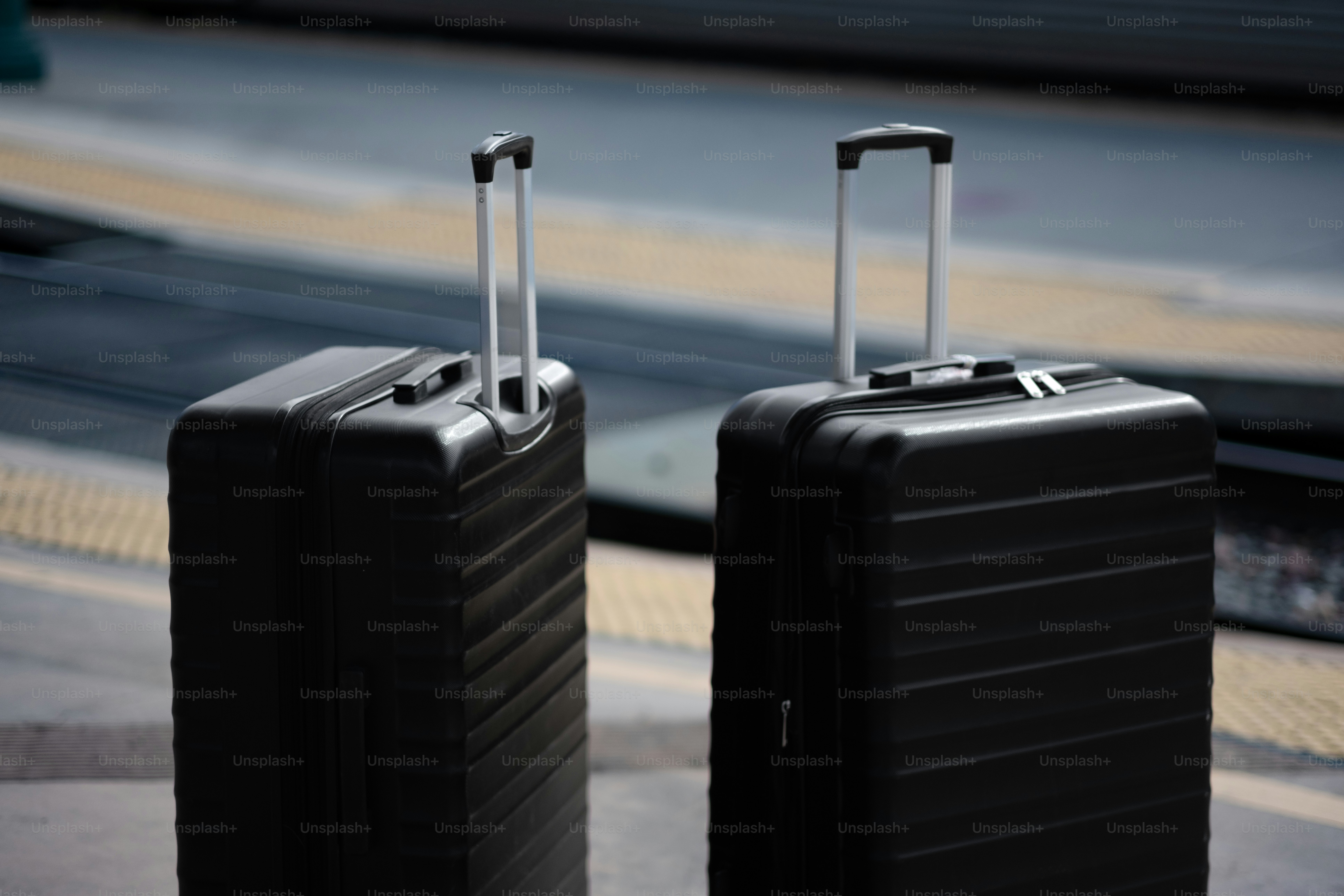 Two black suitcases sitting next to each other photo – Luggage Image on ...