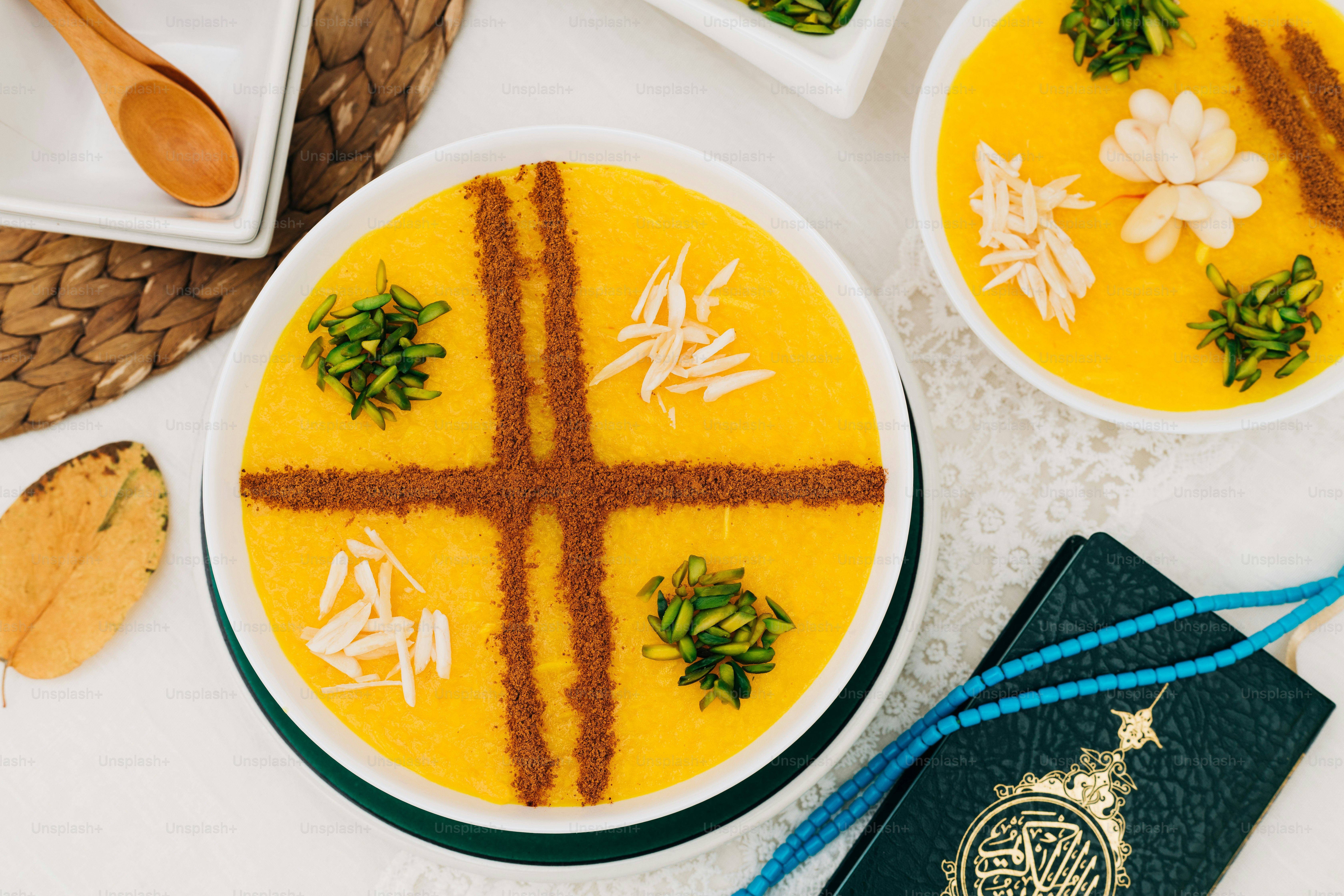 A table topped with plates of food and drinks photo – Islam Image on ...