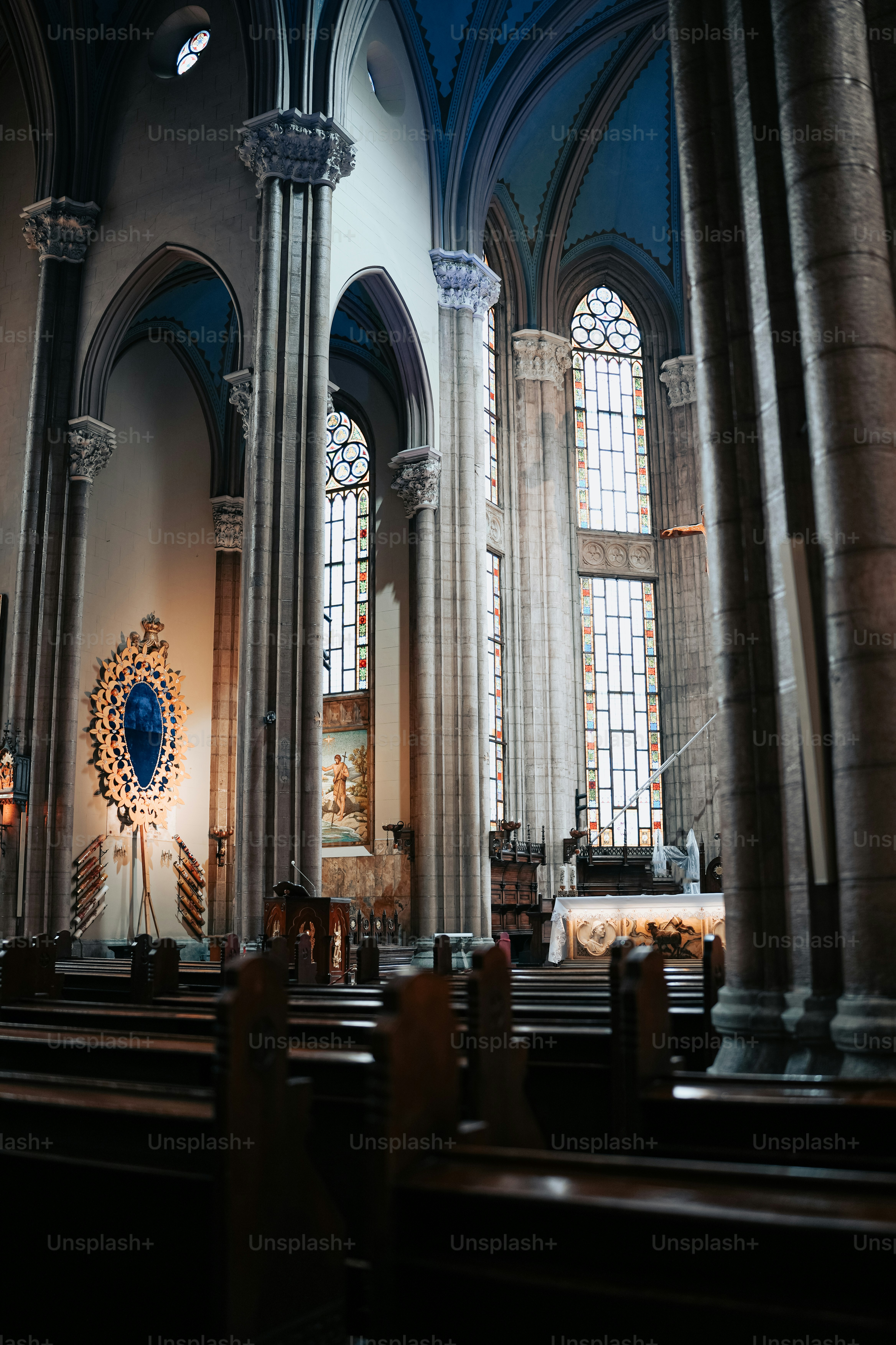 The interior of a church with pews and stained glass windows photo ...