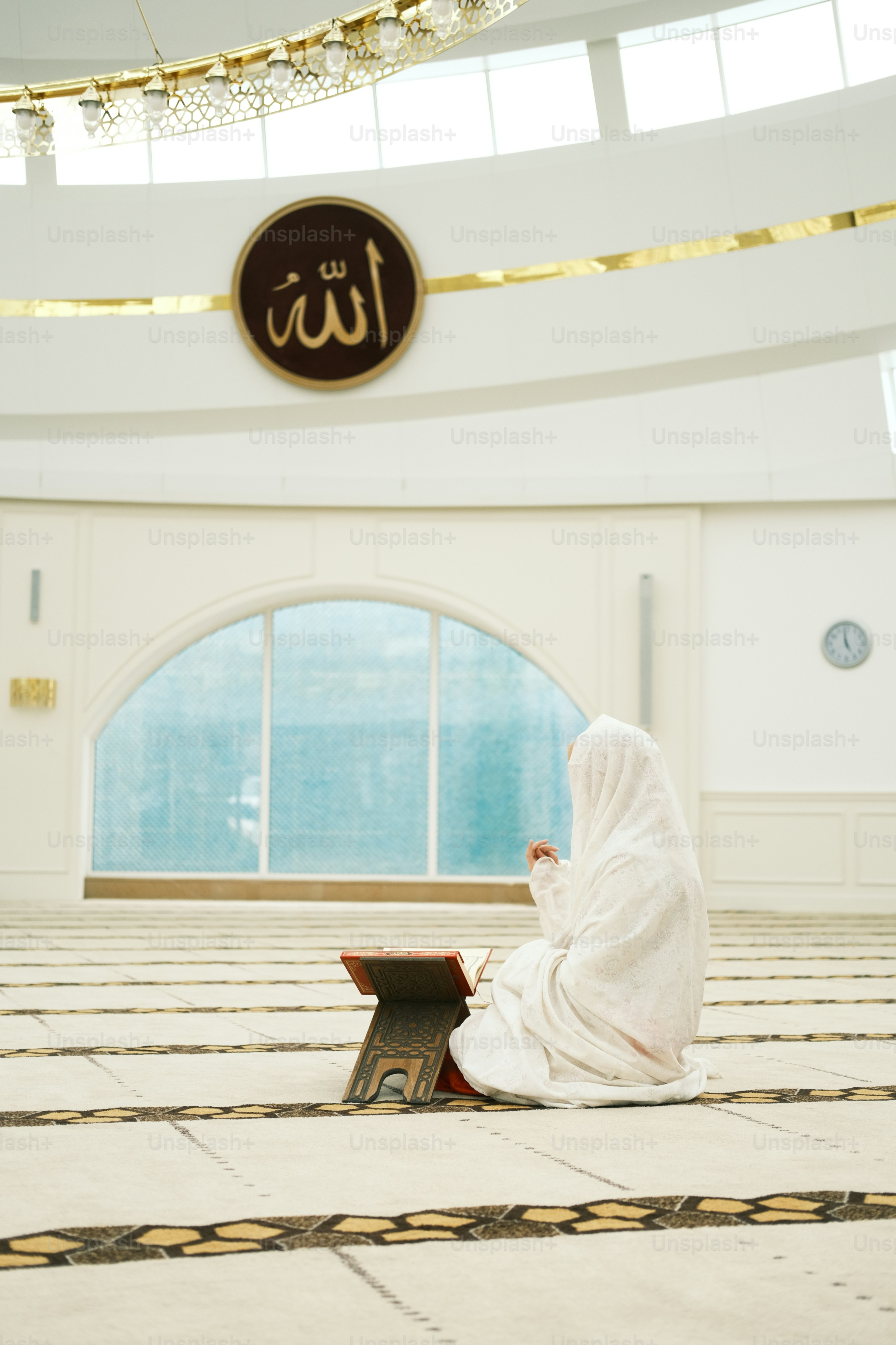 A woman sitting on a rug in a room photo – Islam Image on Unsplash