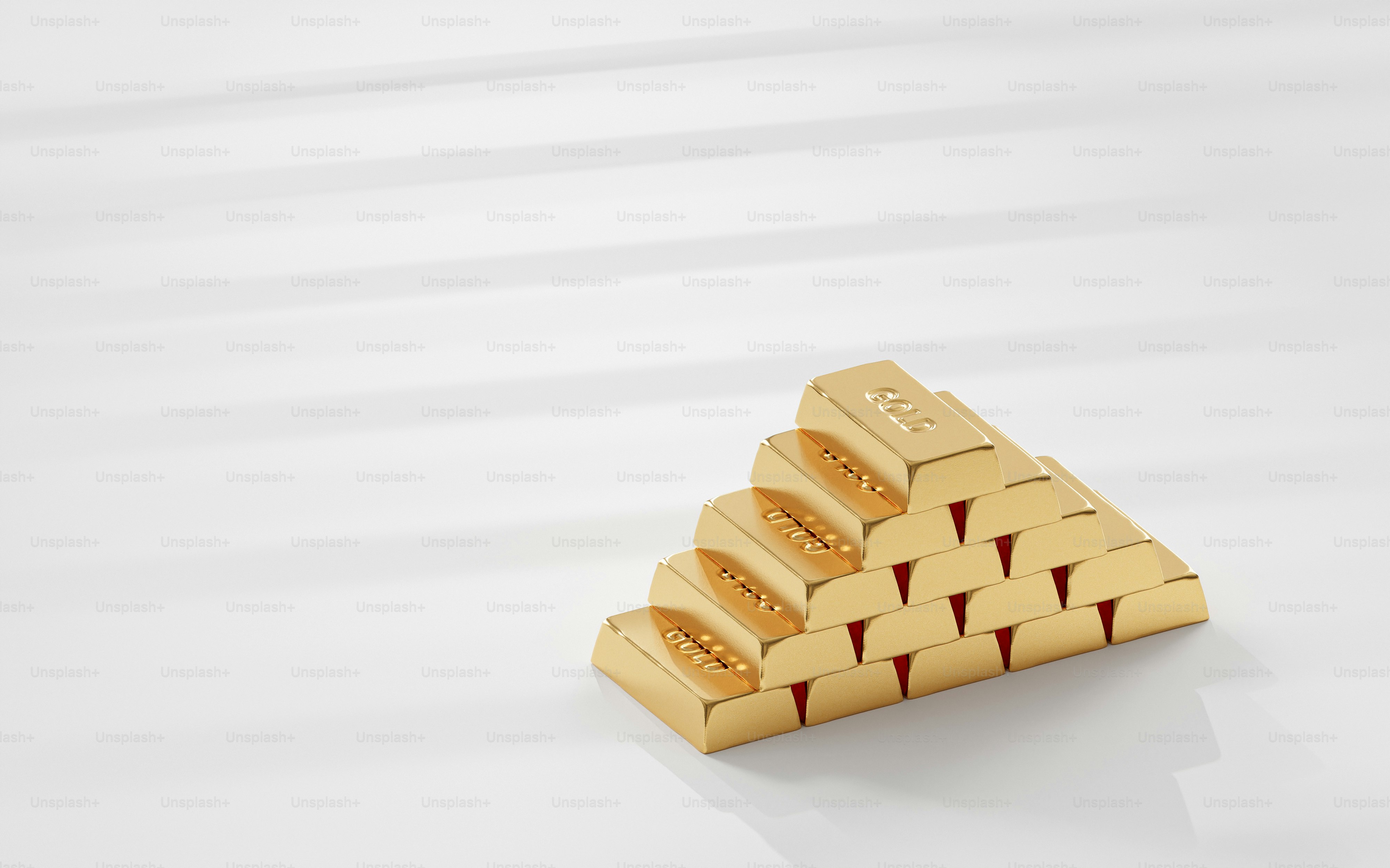 A stack of gold bars sitting on top of each other photo – Gold bar ...