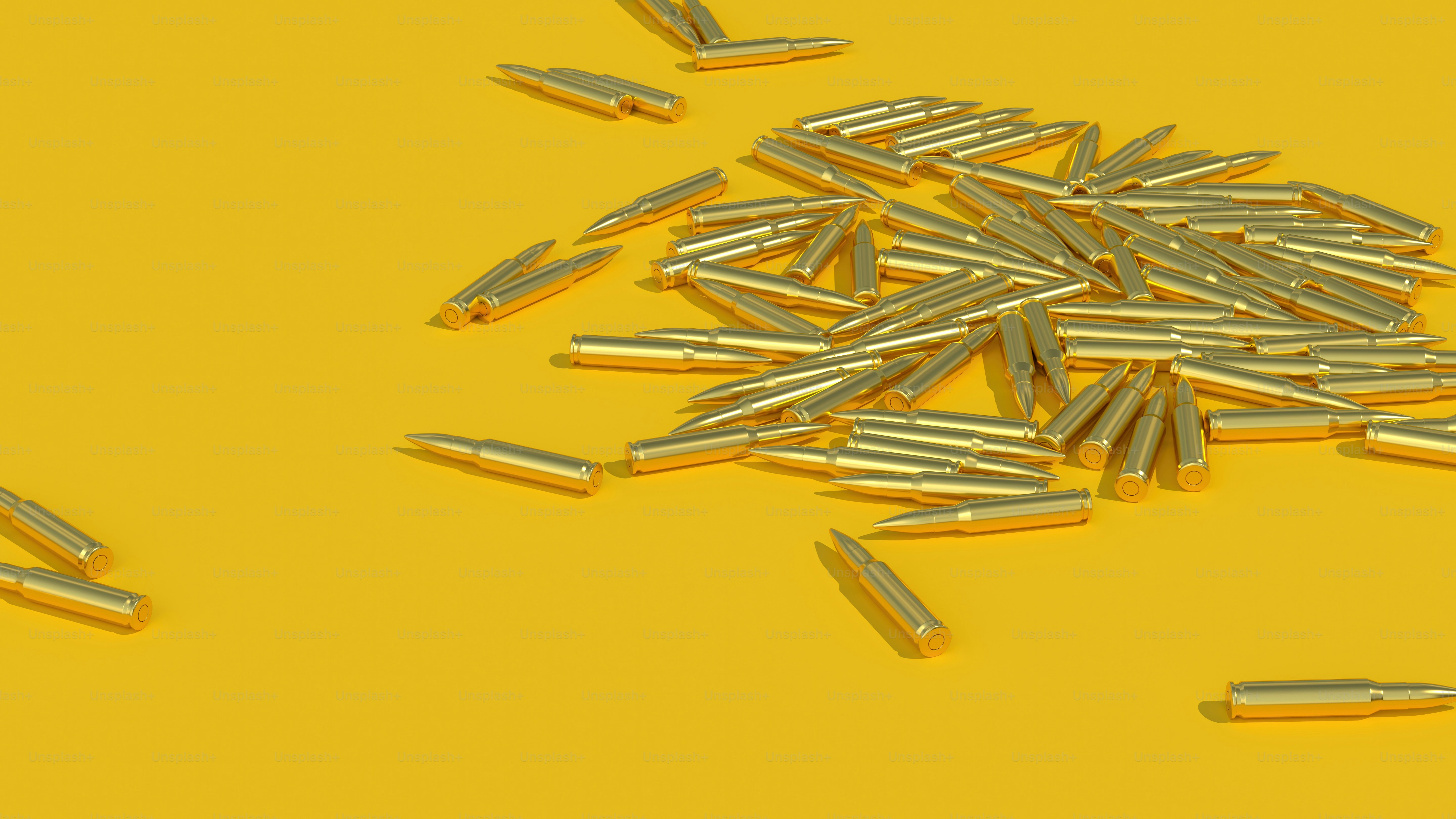 A bunch of bullet shells on a pink background photo – Bullet Image on ...