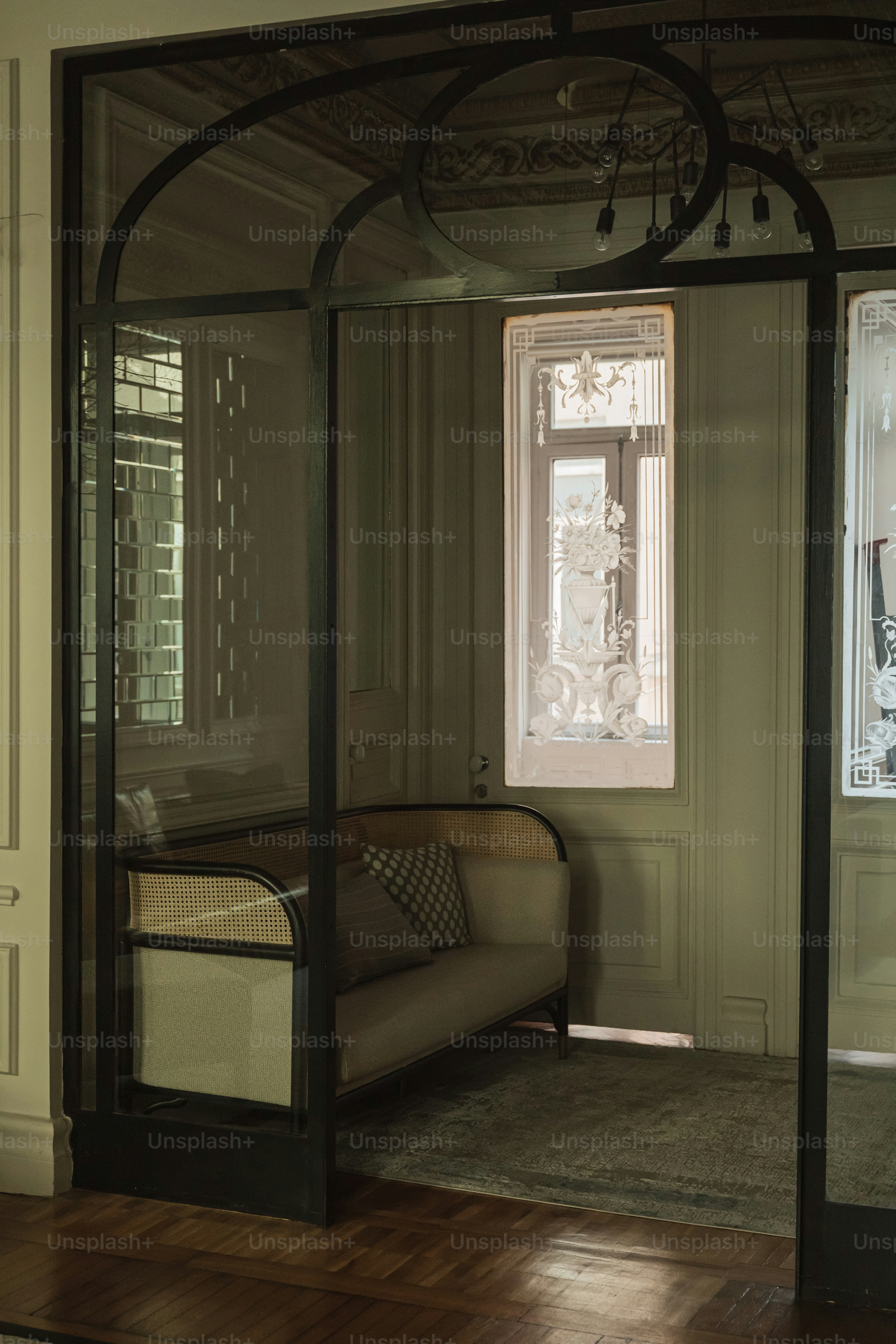A living room with a couch and a window photo – Interior architecture ...