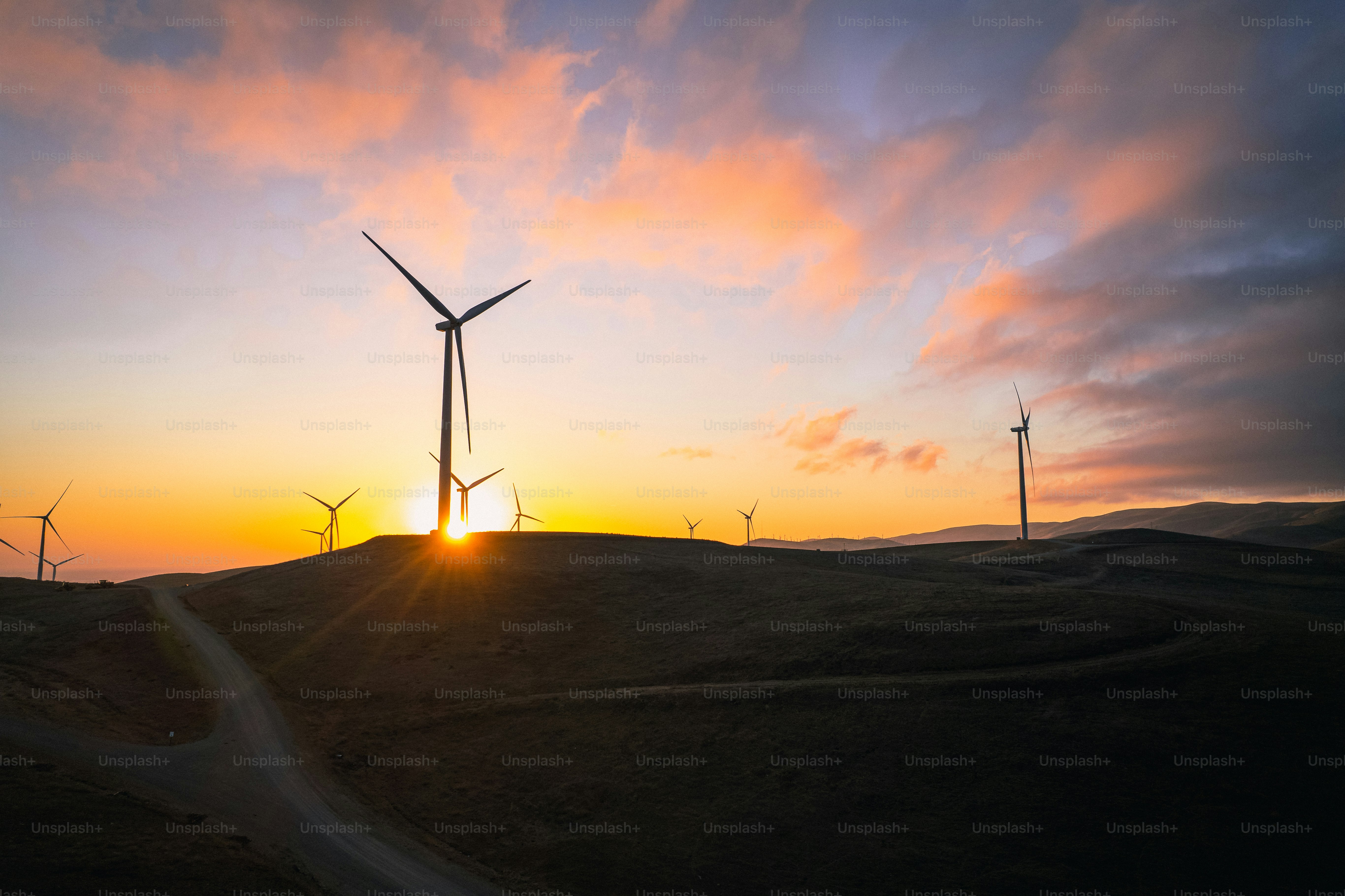 An aerial view of a wind farm with many windmills photo – Electricity ...