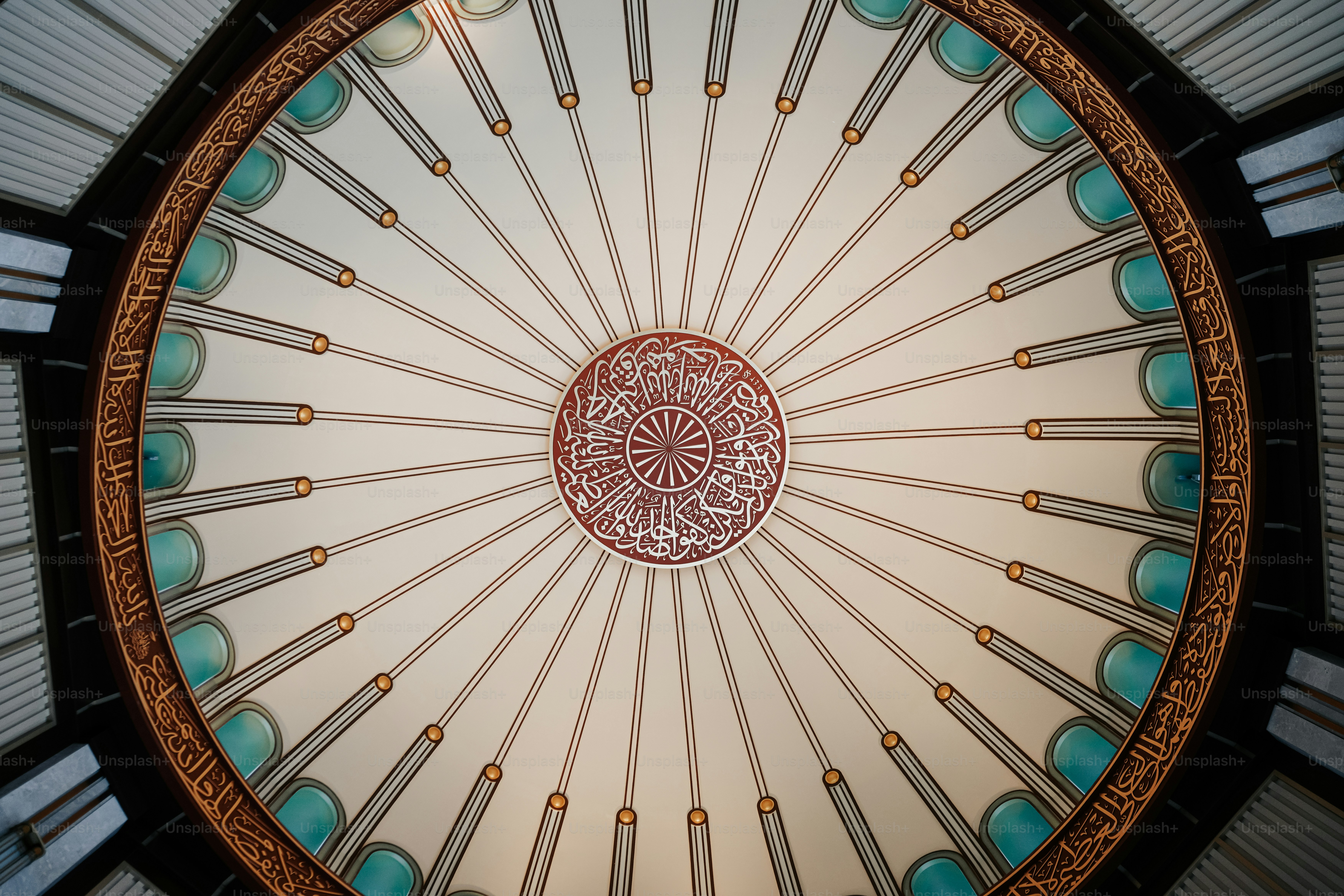 The ceiling of a building has a circular design on it photo – Circle ...