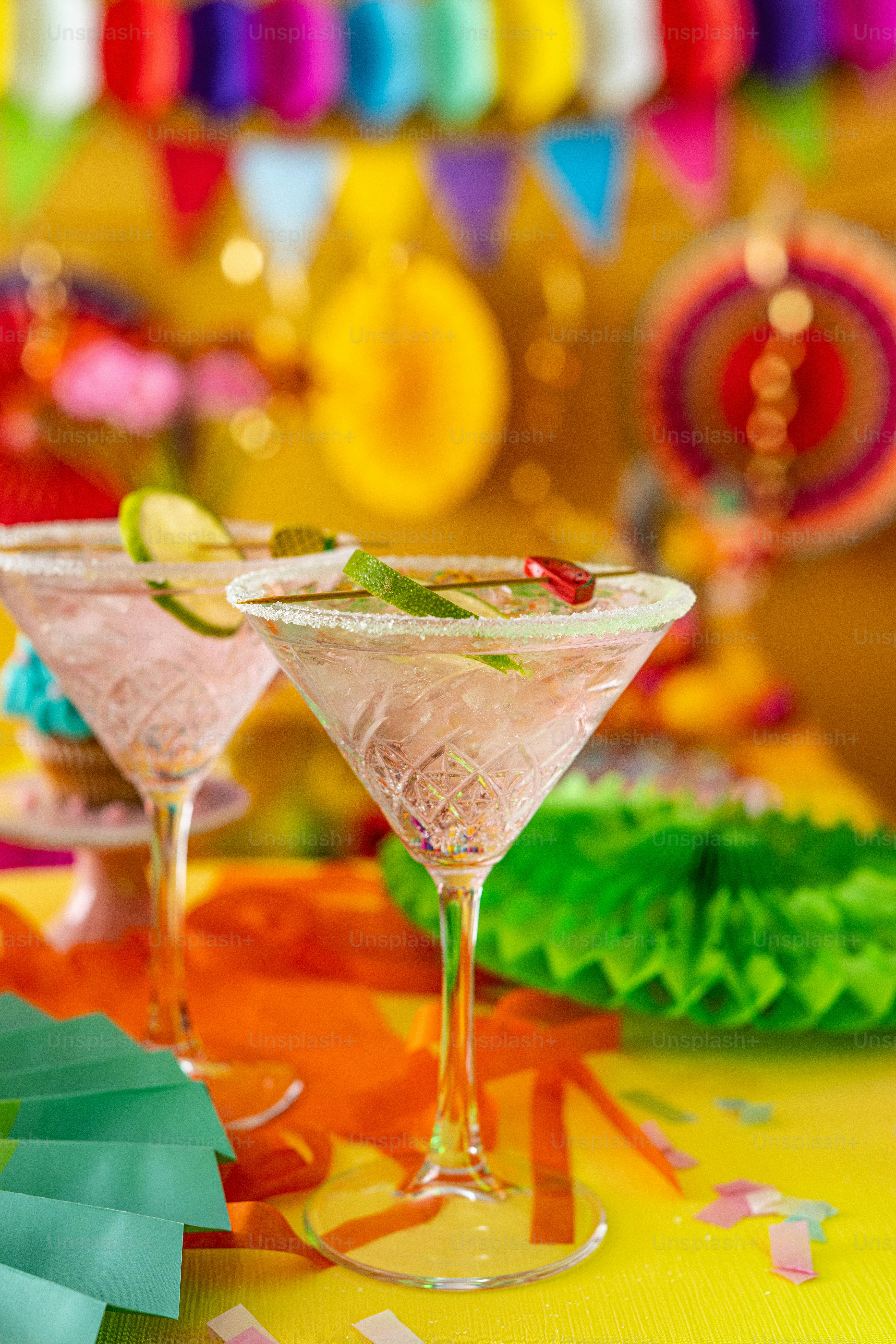 Two martinis with a lime slice on the rim photo – Margarita Image on ...