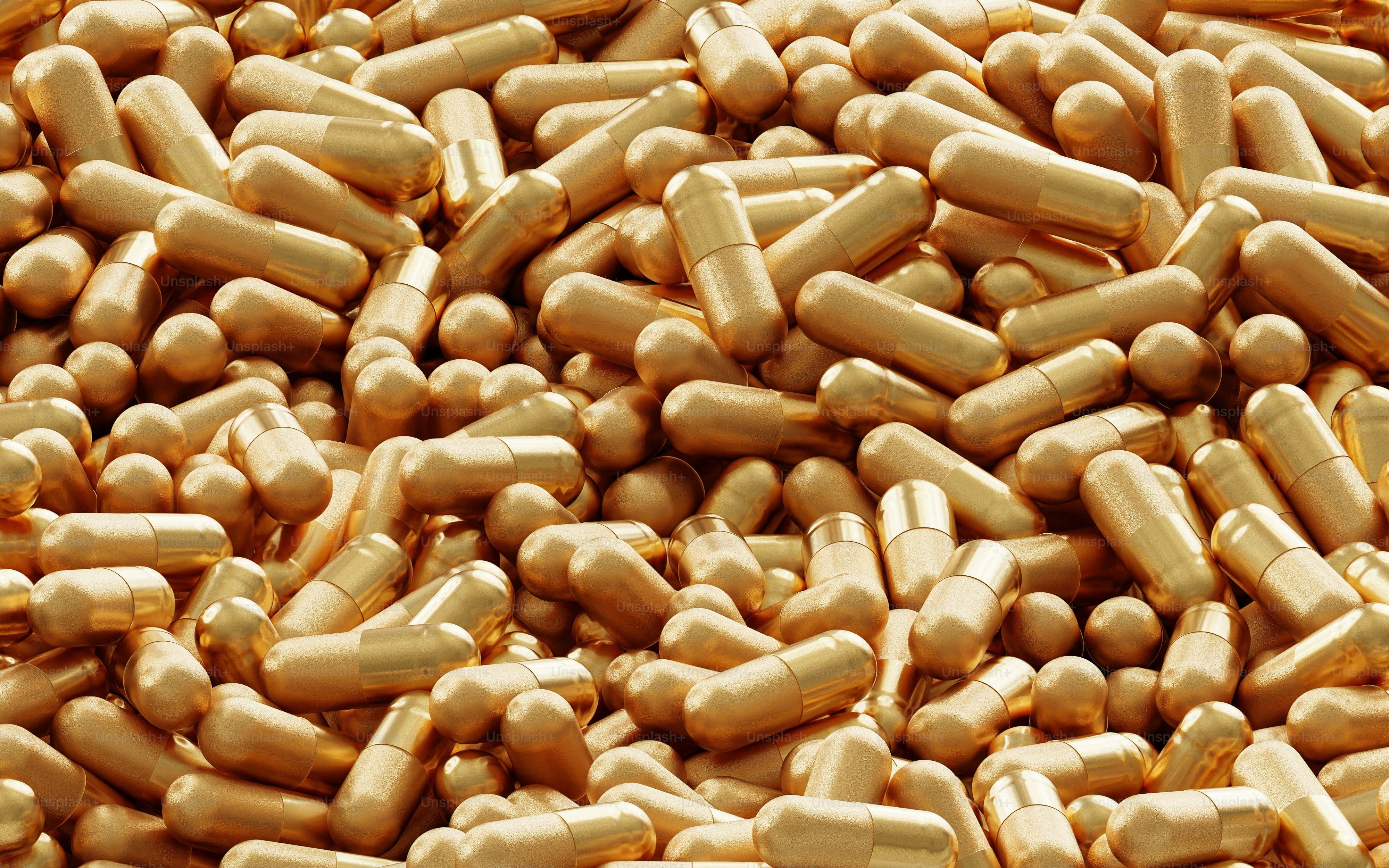 A pile of gold pills sitting next to each other photo – Render Image on ...