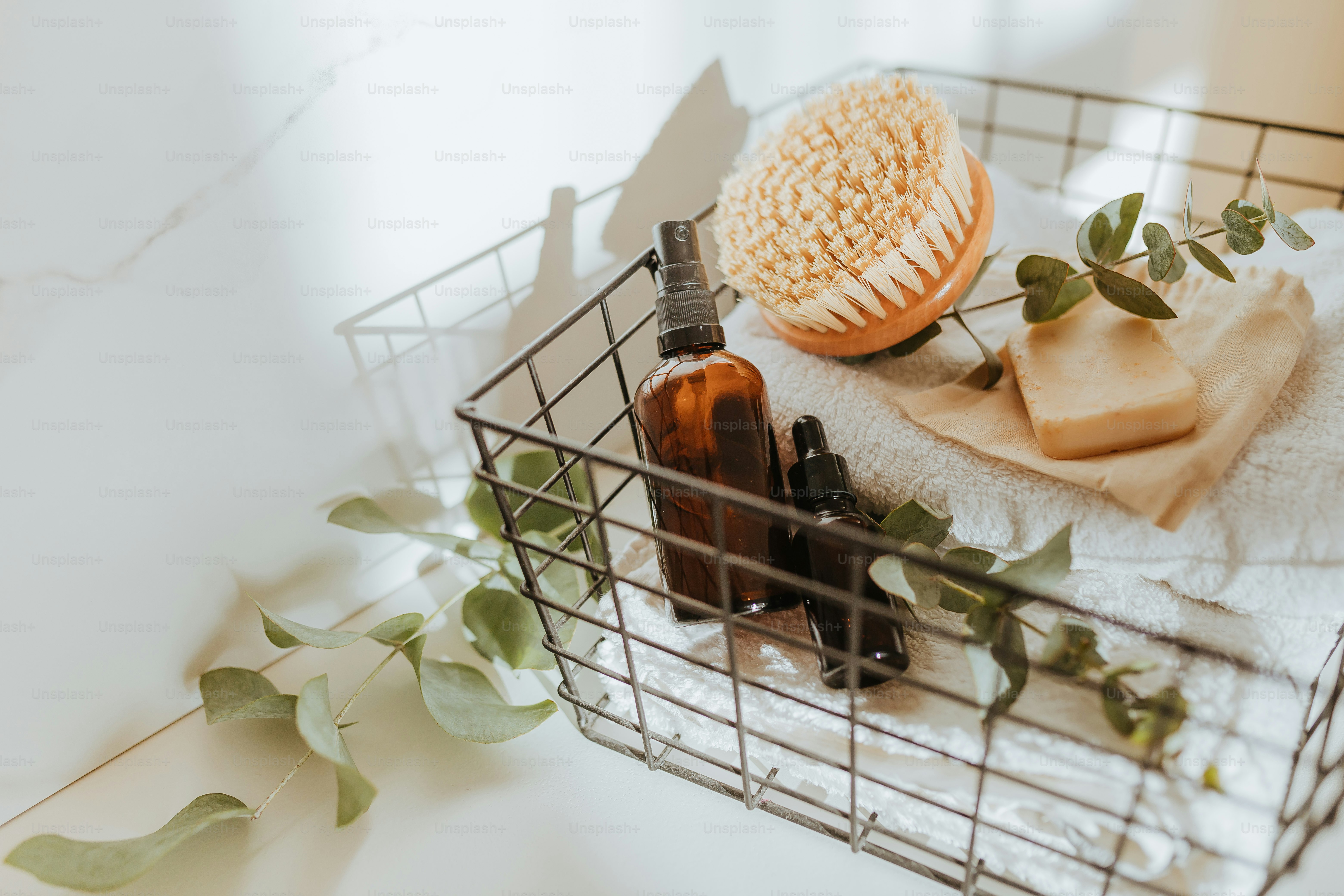 A basket filled with soap and a bottle of lotion photo – Body oil Image ...
