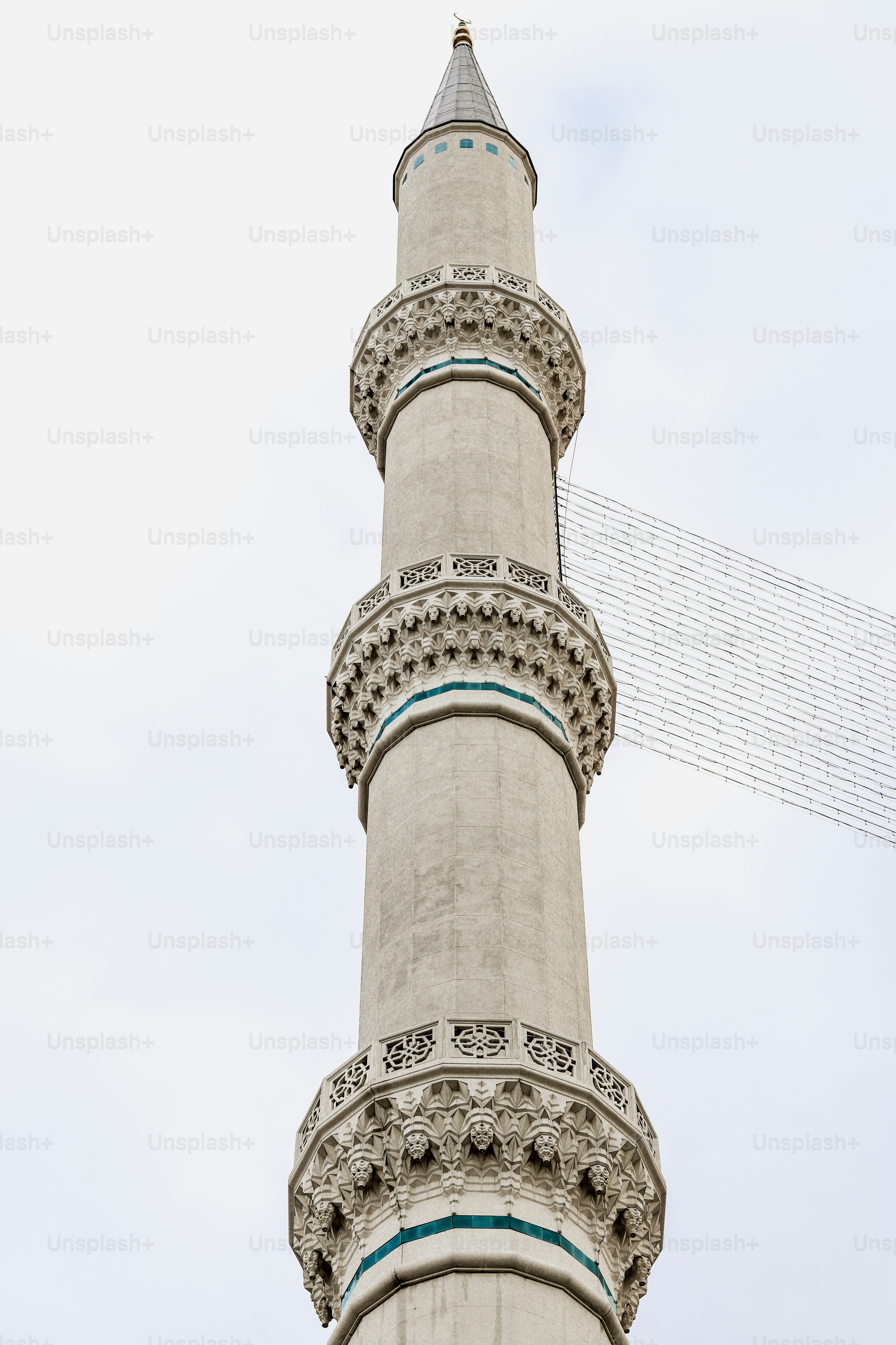 A tall white tower with a clock on it's side photo – Faith Image on ...