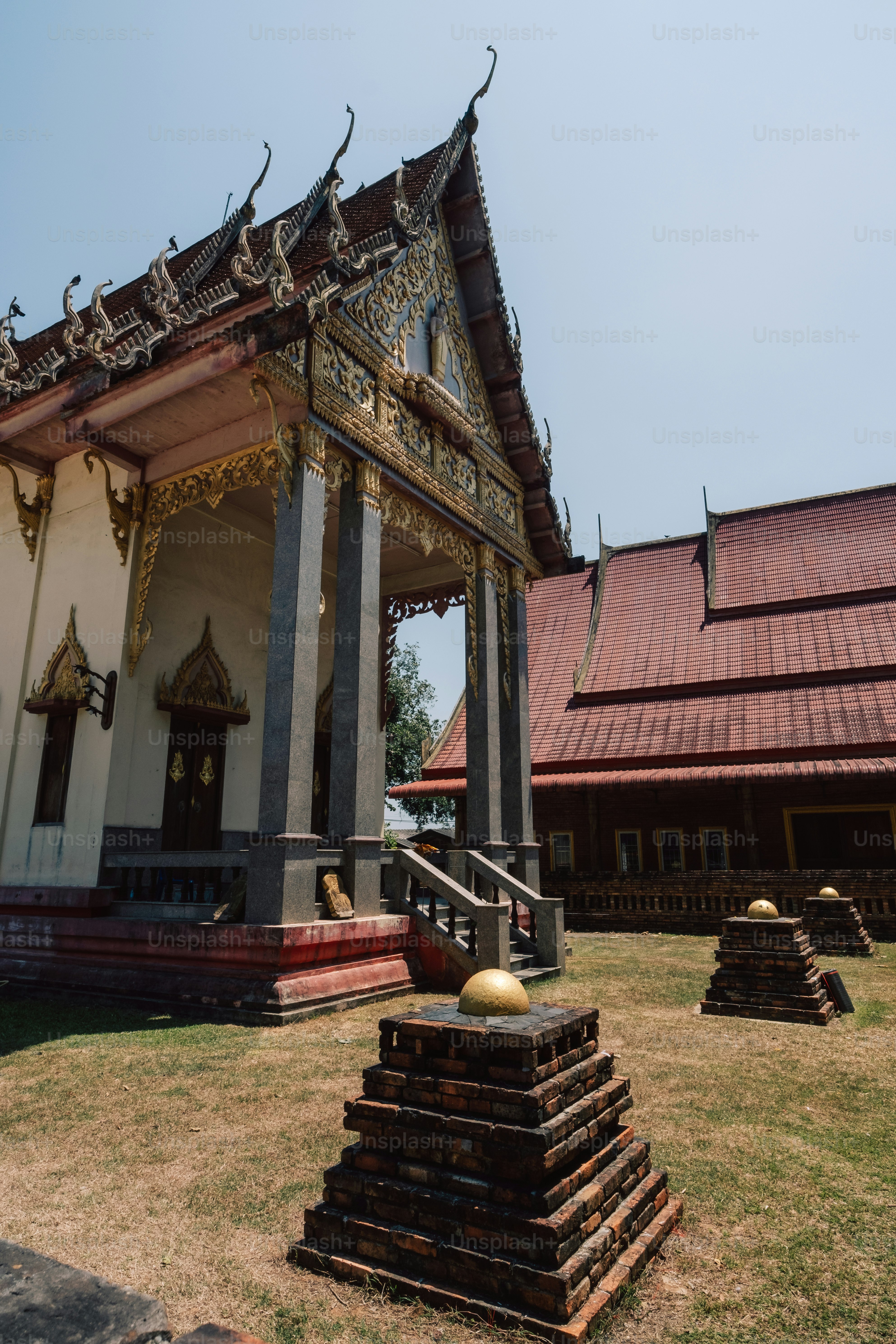 A building that has a bunch of steps in front of it photo – Zen Image ...