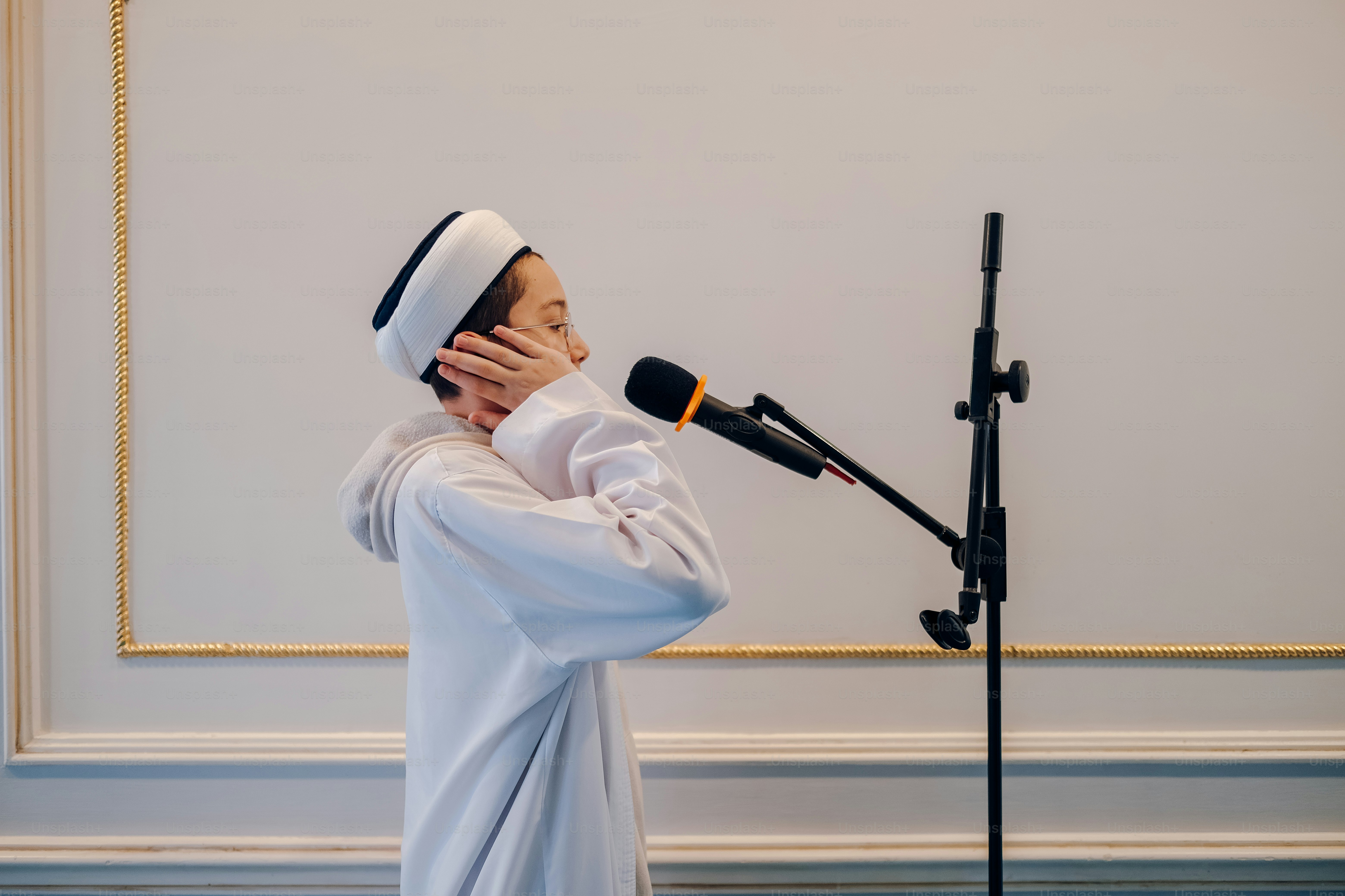 A man standing in front of a microphone photo – Prayer Image on Unsplash