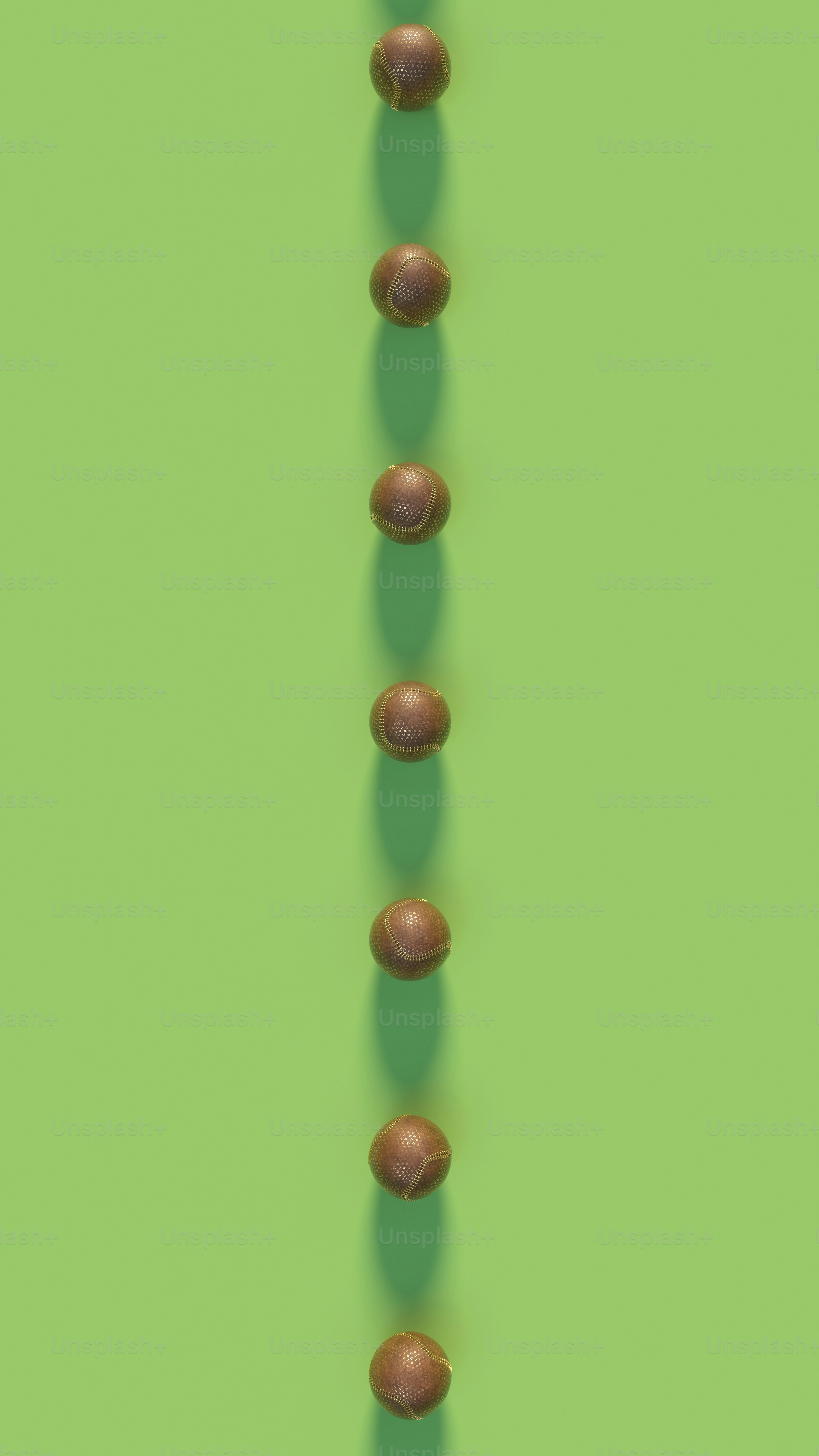 A long line of nuts on a green background photo – Baseball Image on ...