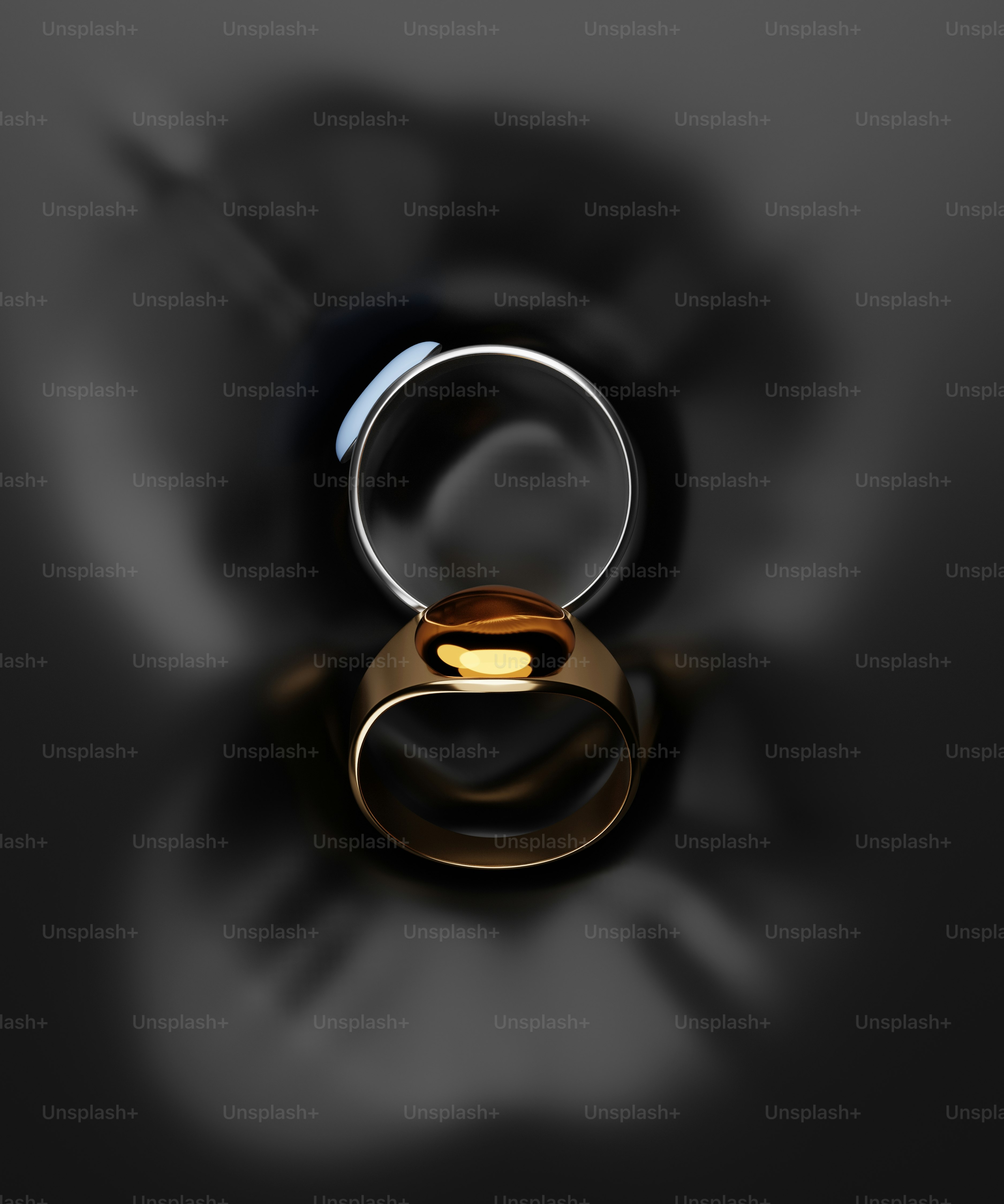 A couple of rings sitting on top of each other photo – Jewellery Image ...