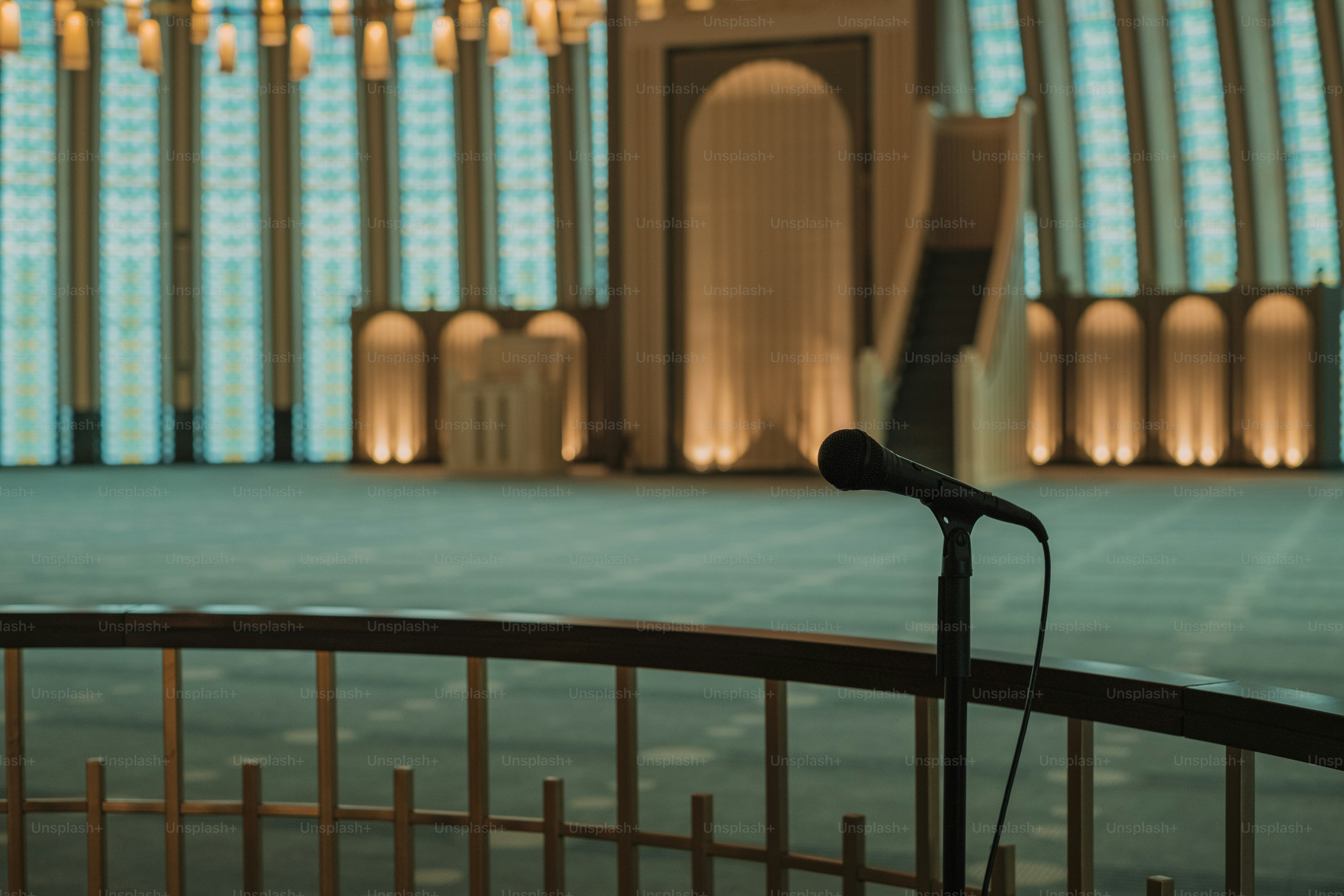 A microphone sitting in front of a large building photo – Comedy show ...