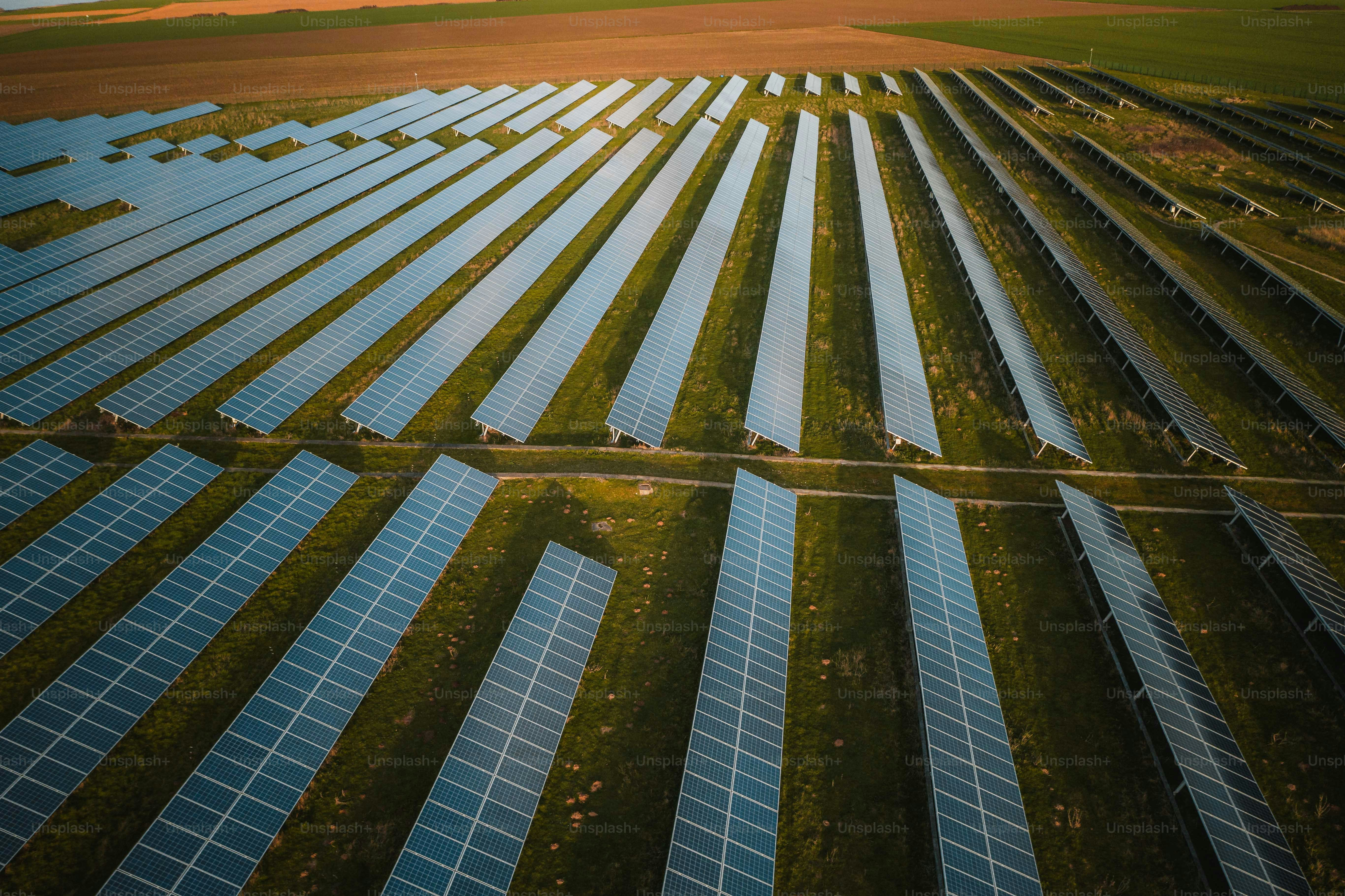 An aerial view of a large solar farm photo – Solar panels Image on Unsplash