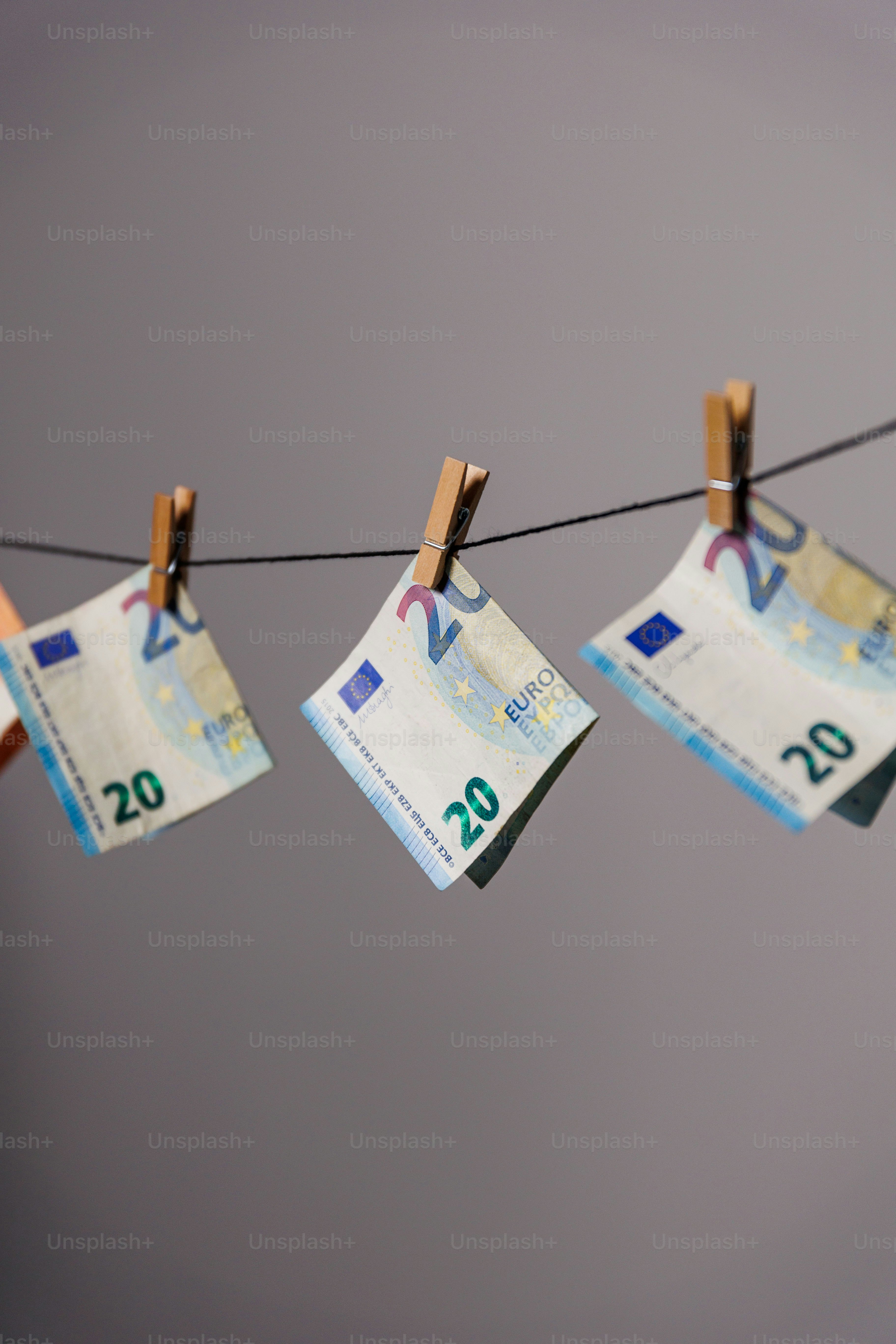 A bunch of money hanging on a clothes line photo – Ahorro Image on Unsplash