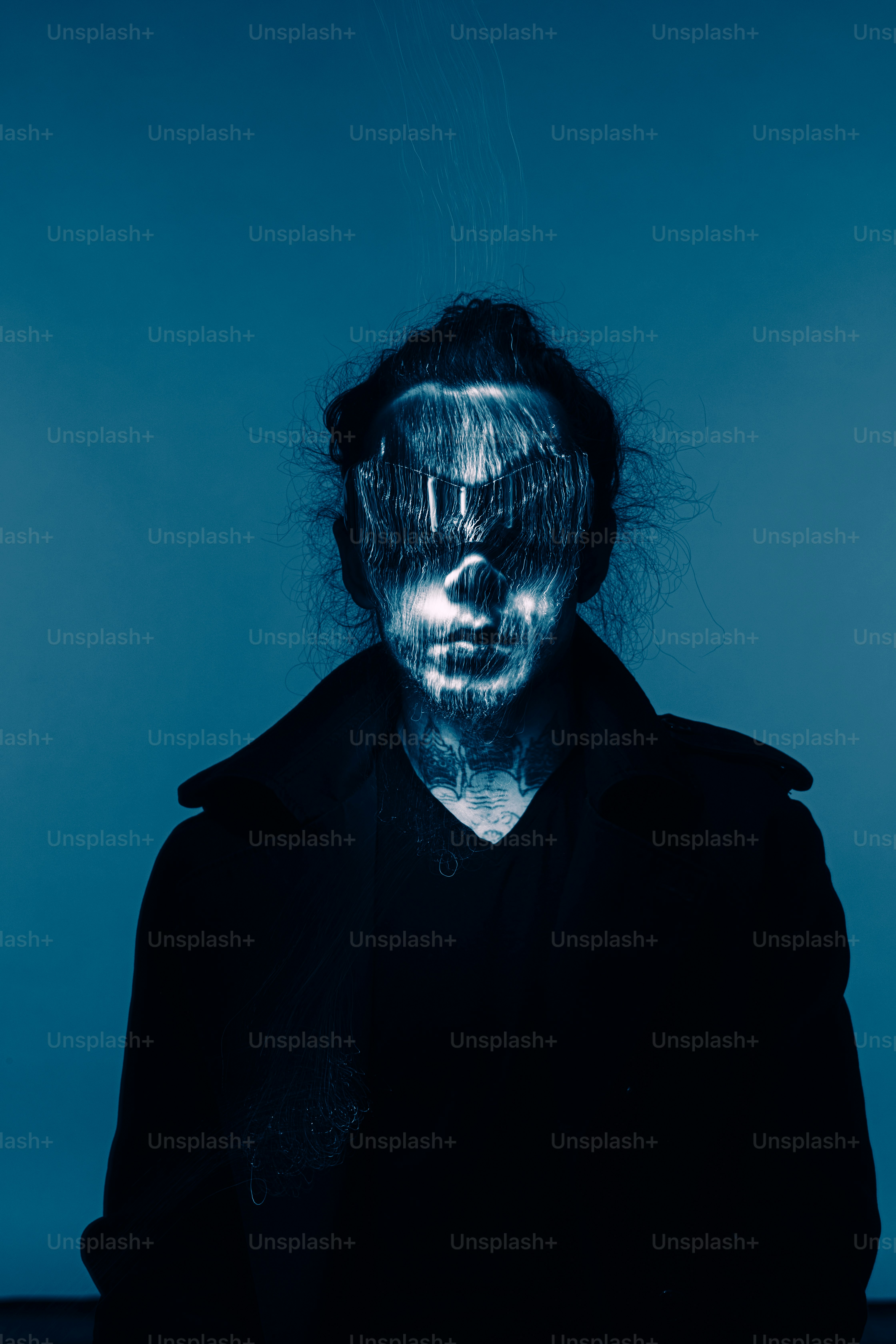 A man with his face painted like a ghost photo – Futurism Image on Unsplash