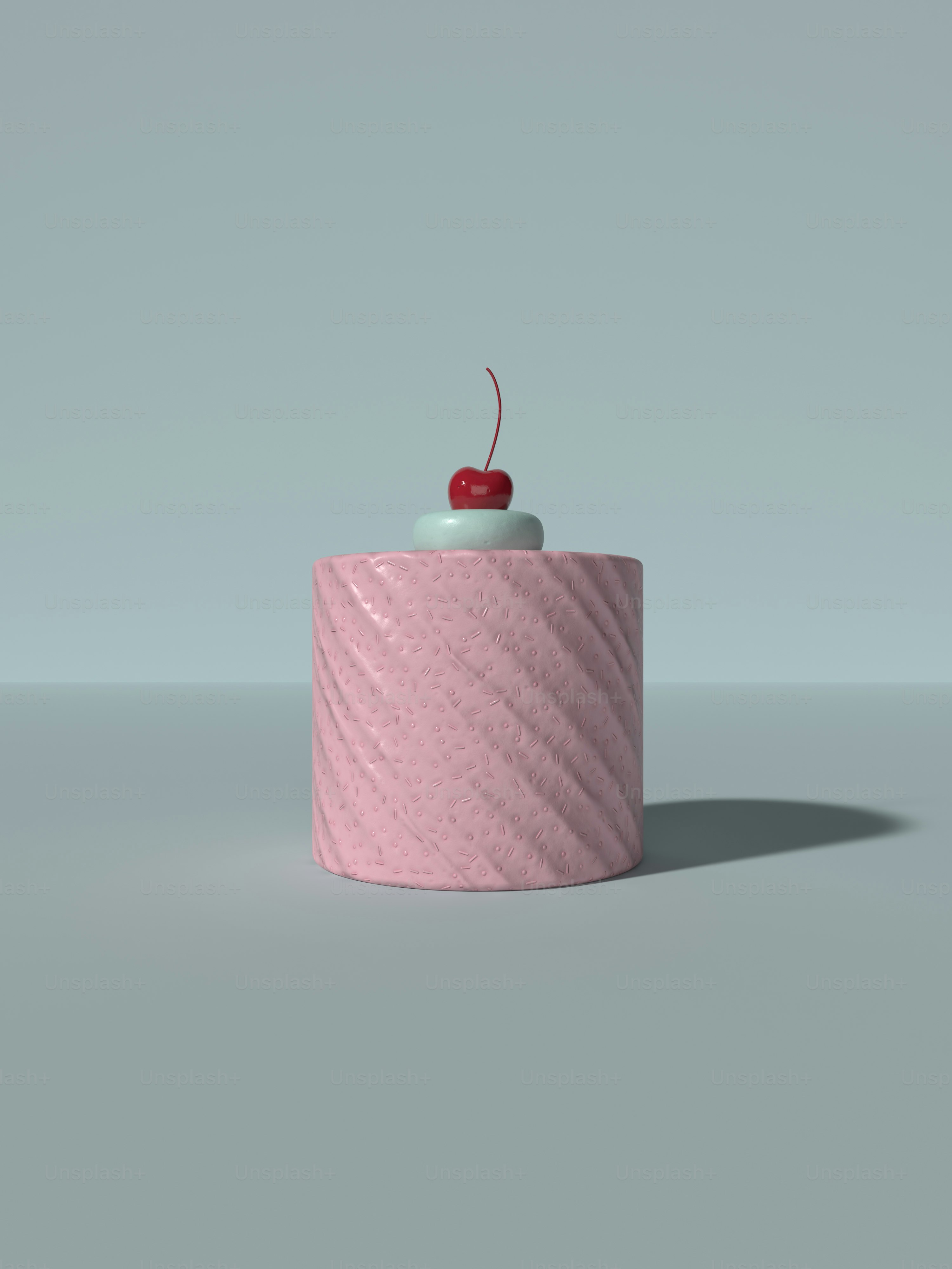 A pink object with a cherry on top of it photo – Cherry Image on Unsplash