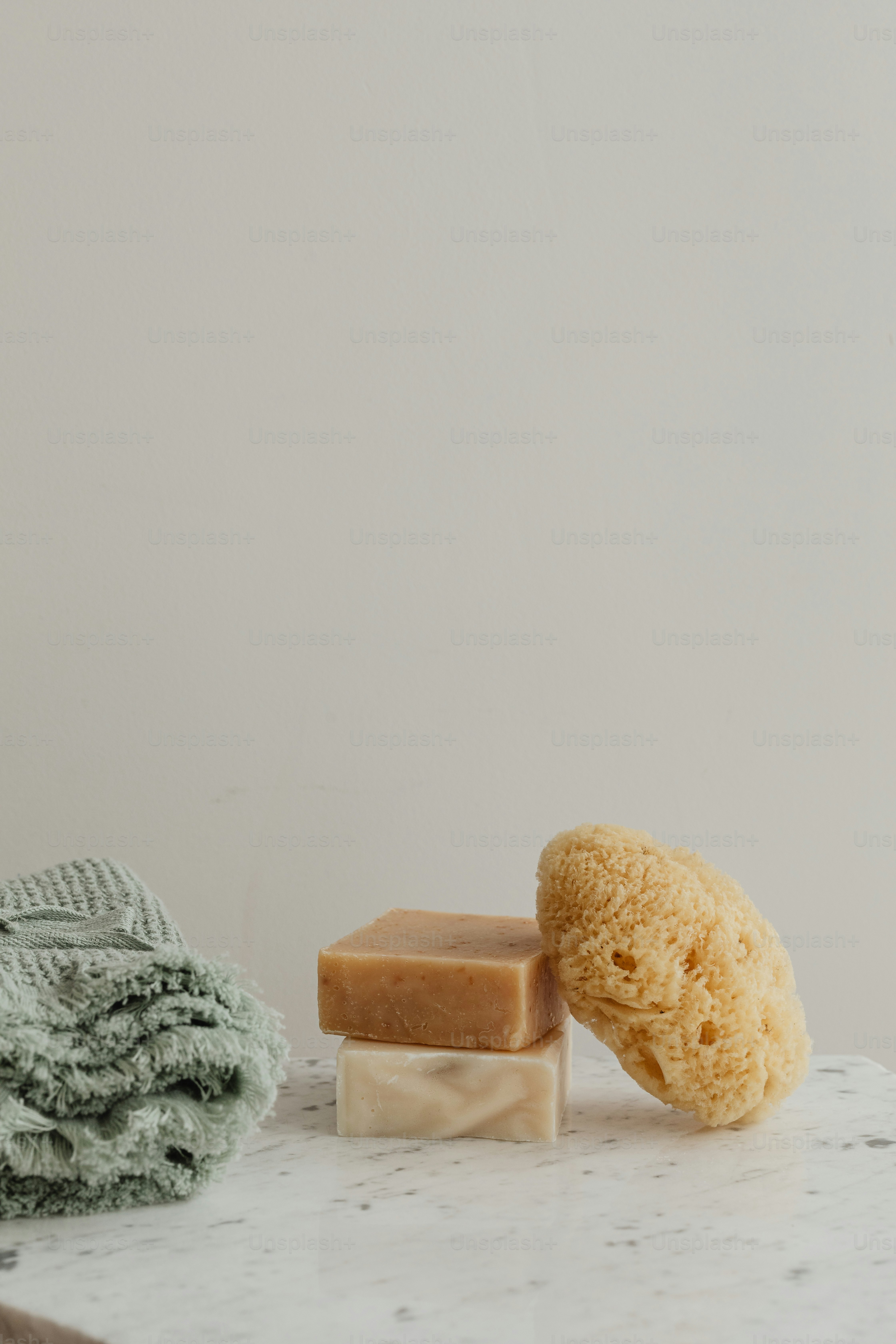 A couple of soaps sitting on top of a counter photo – Skincare Image on ...