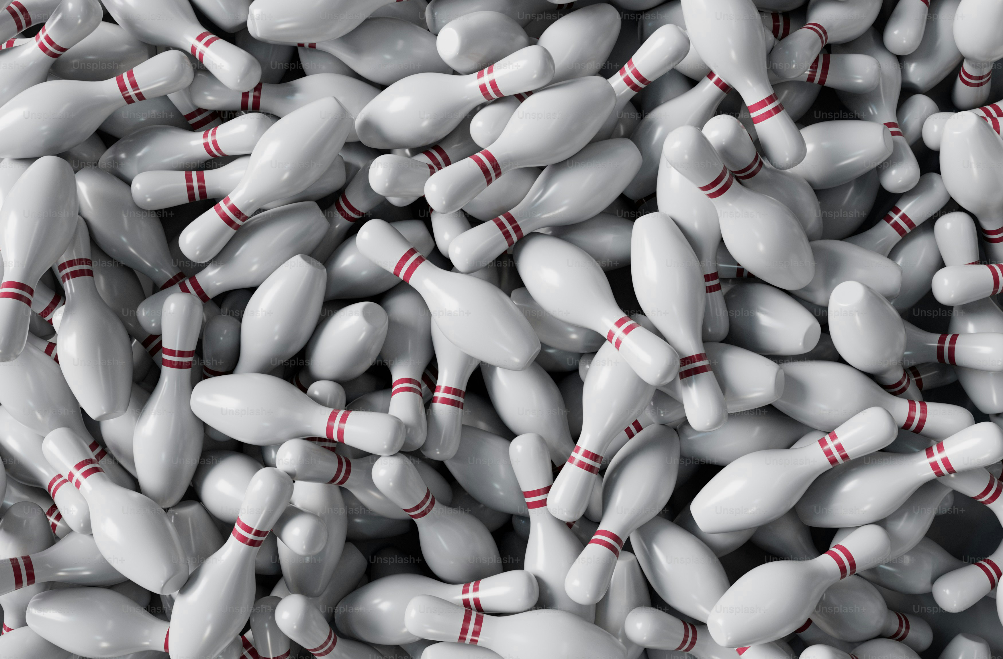 A pile of white bowling pins with red pins on them photo – Bowling ...