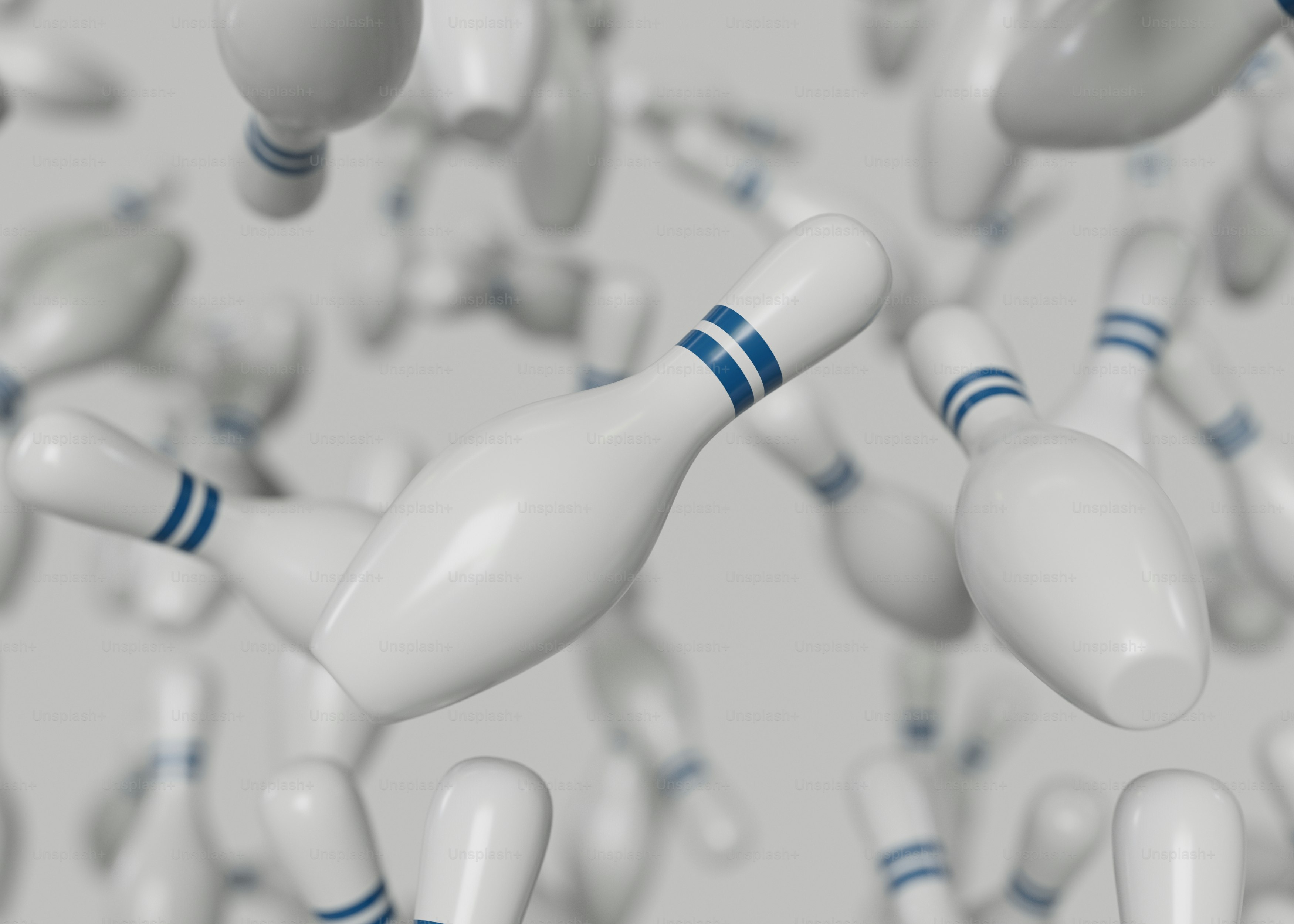 A pile of white bowling pins with red pins on them photo – Bowling ...