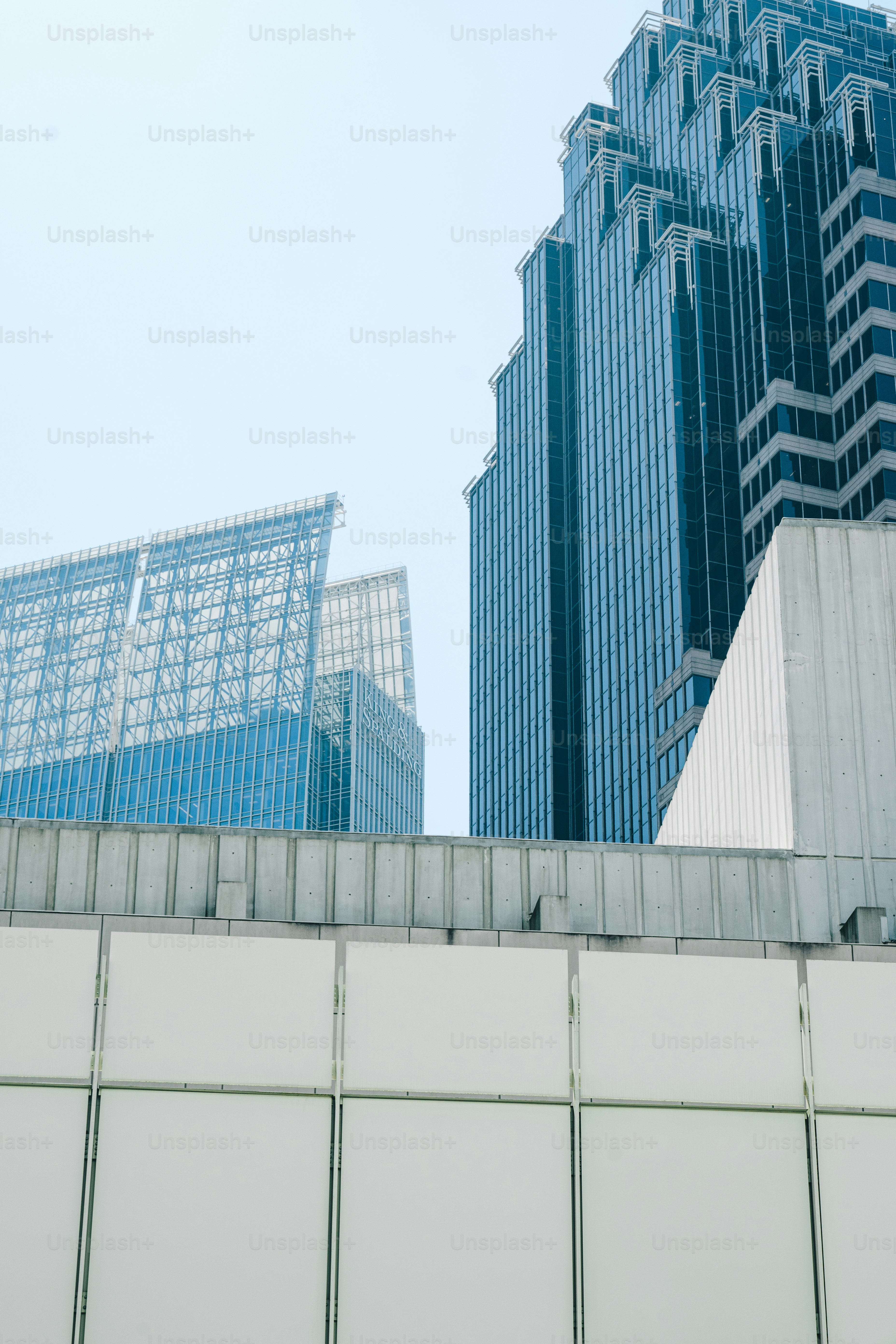 A view of some very tall buildings in the city photo – Sky scraper ...